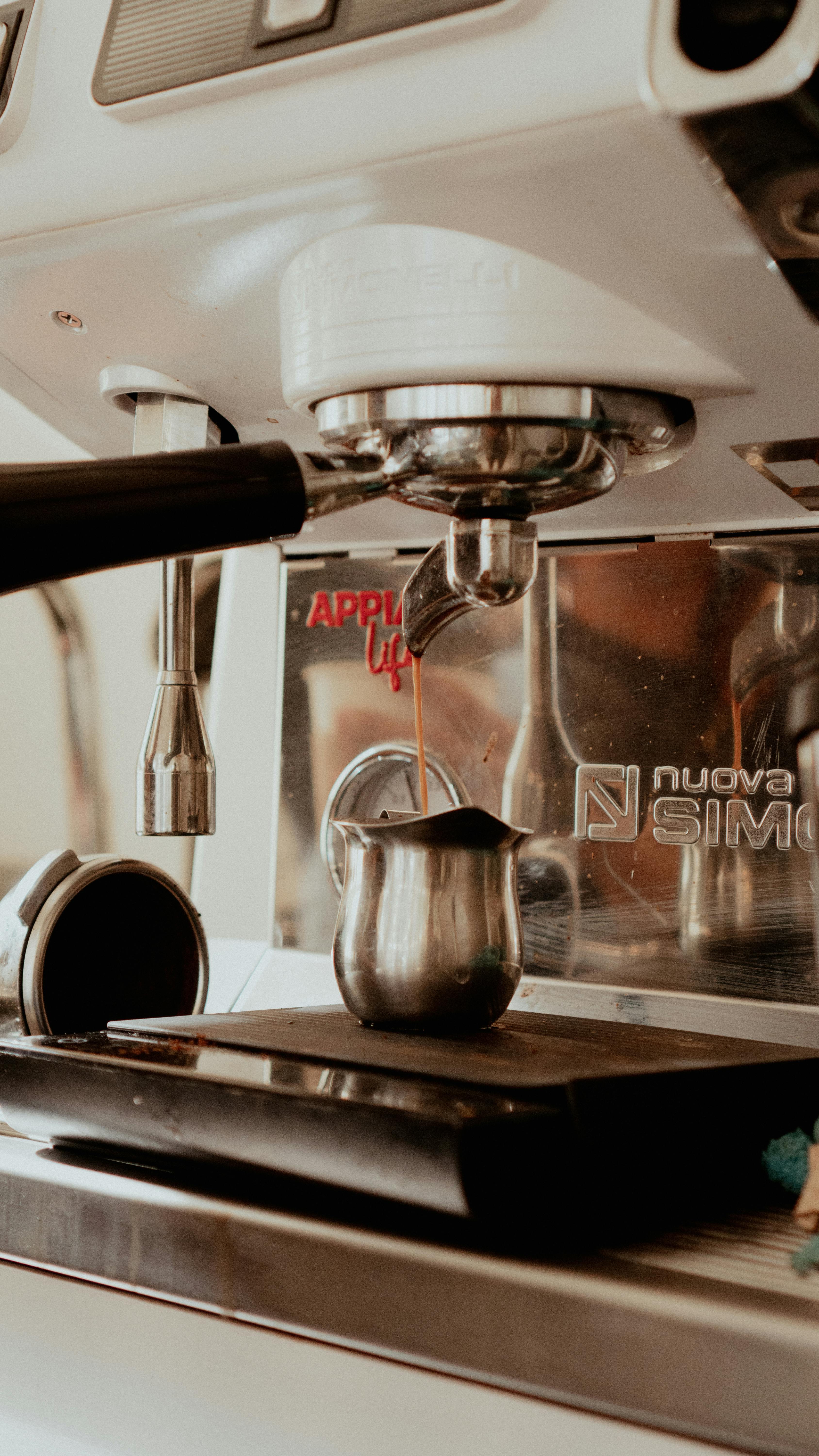 Coffee Machine Pouring Coffee to Pitcher · Free Stock Photo