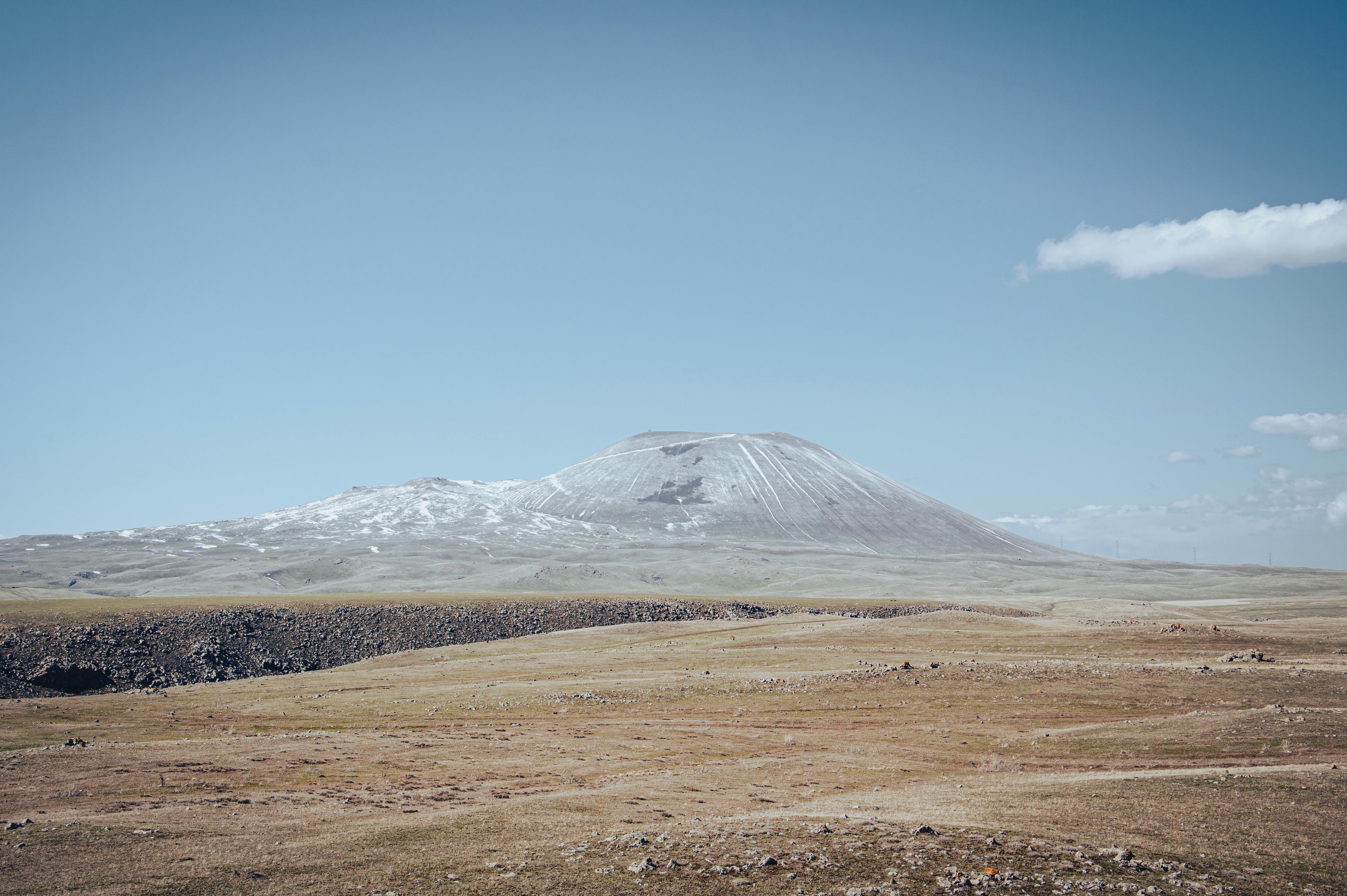 Arid Plains and Hill behind · Free Stock Photo