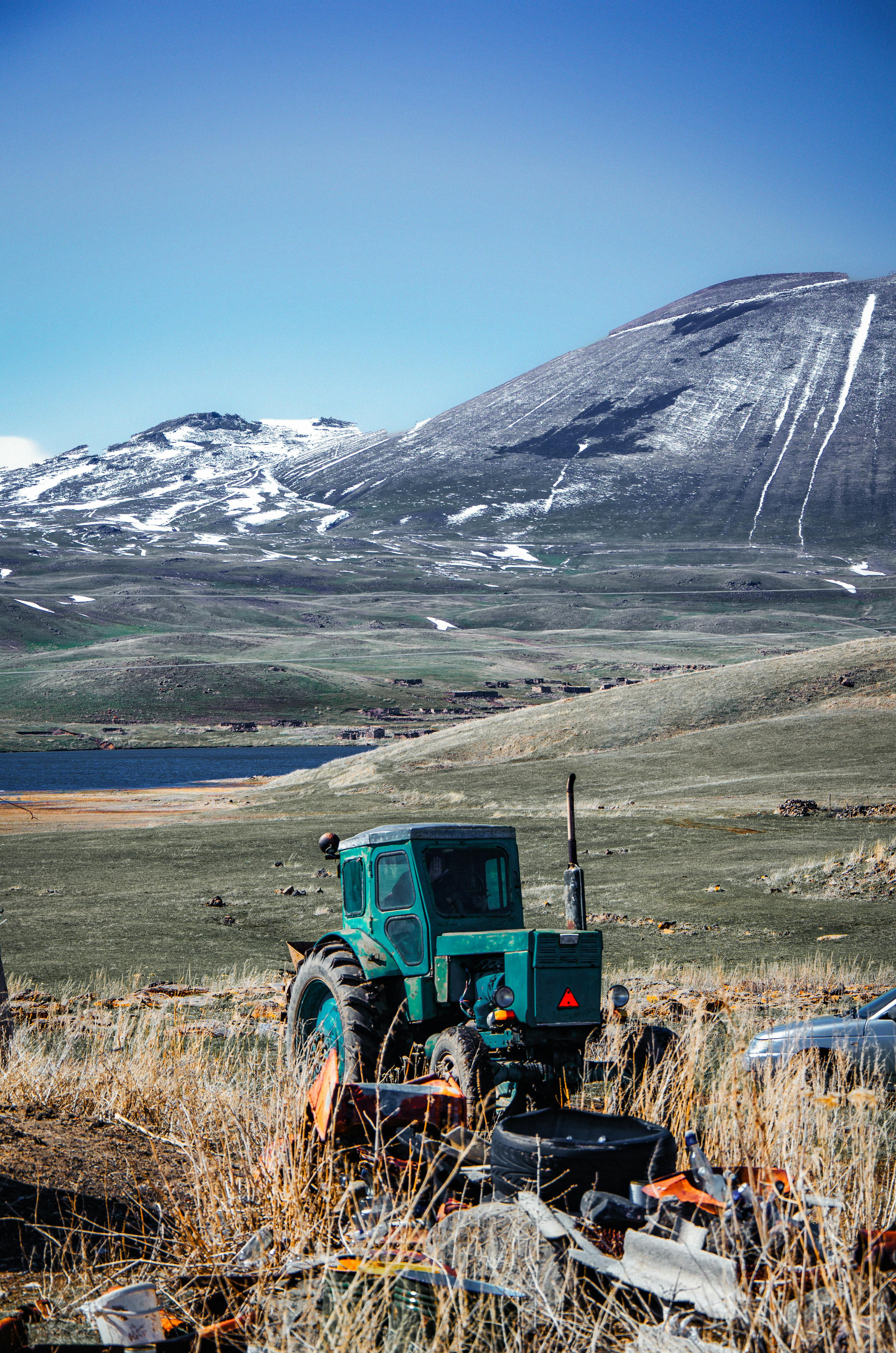 Tractor and Hills behind · Free Stock Photo