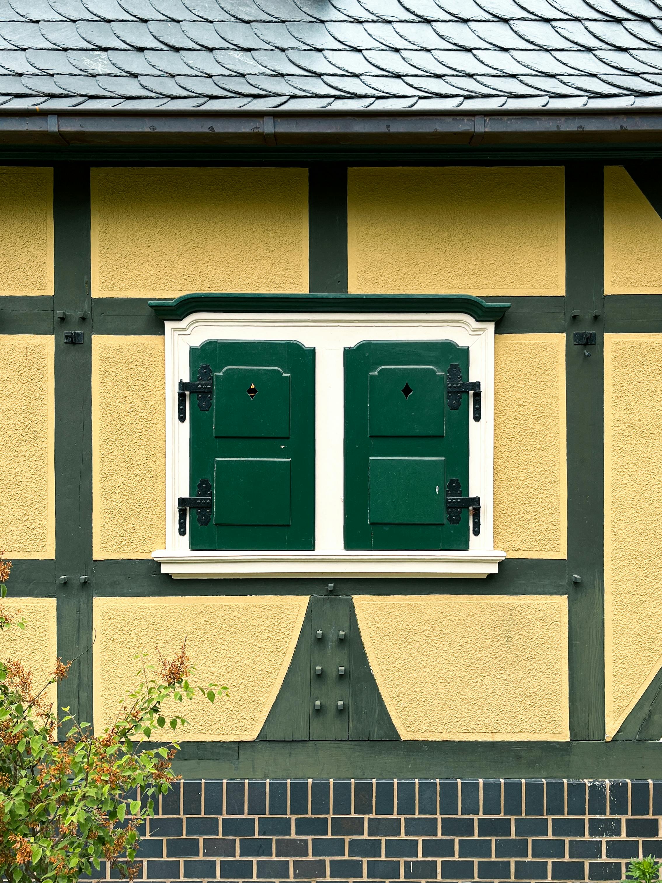 Front Of A House With Green Wooden Window · Free Stock Photo