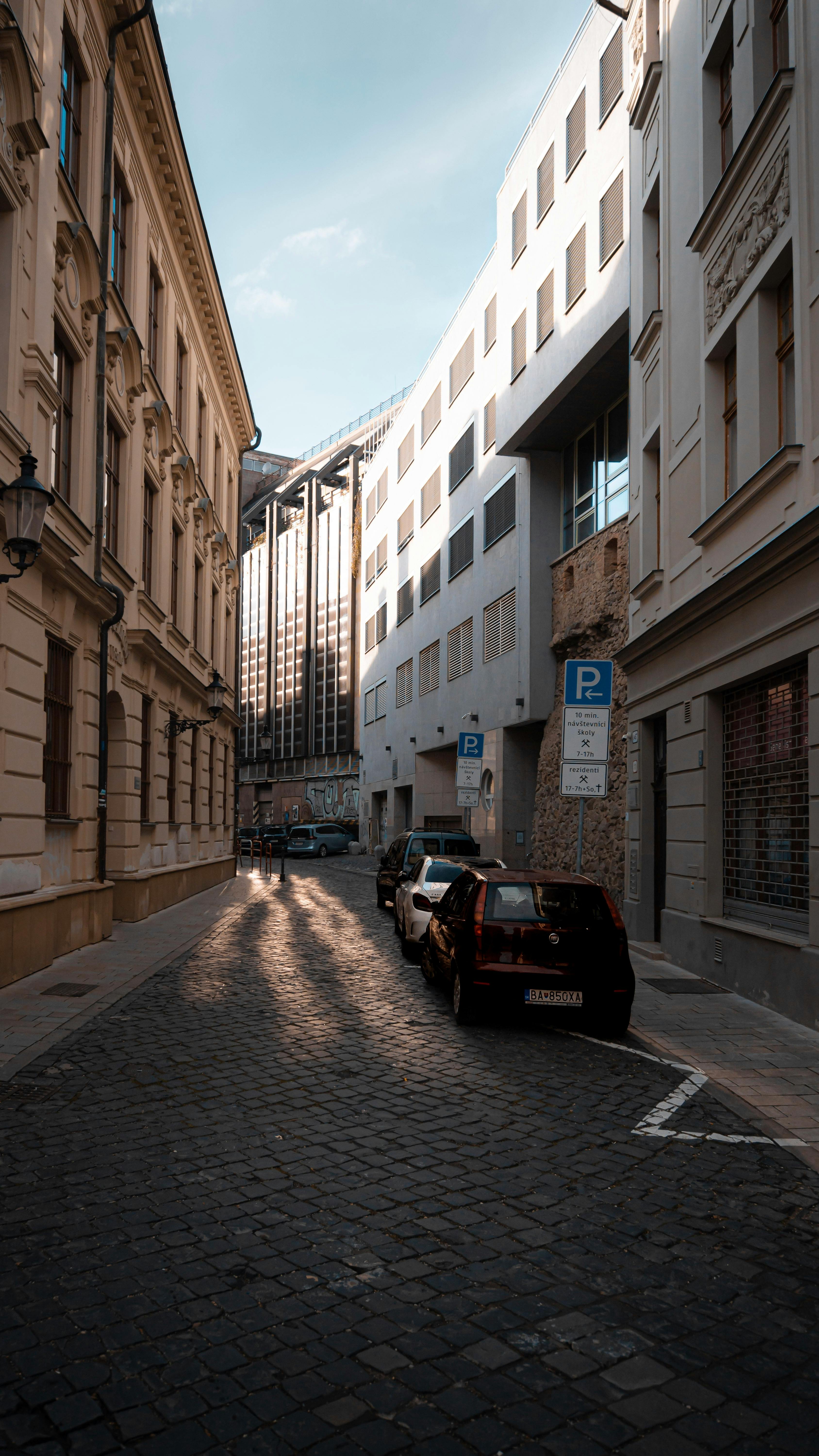 Black Saab 900 Car Parked on a Sloped Street · Free Stock Photo