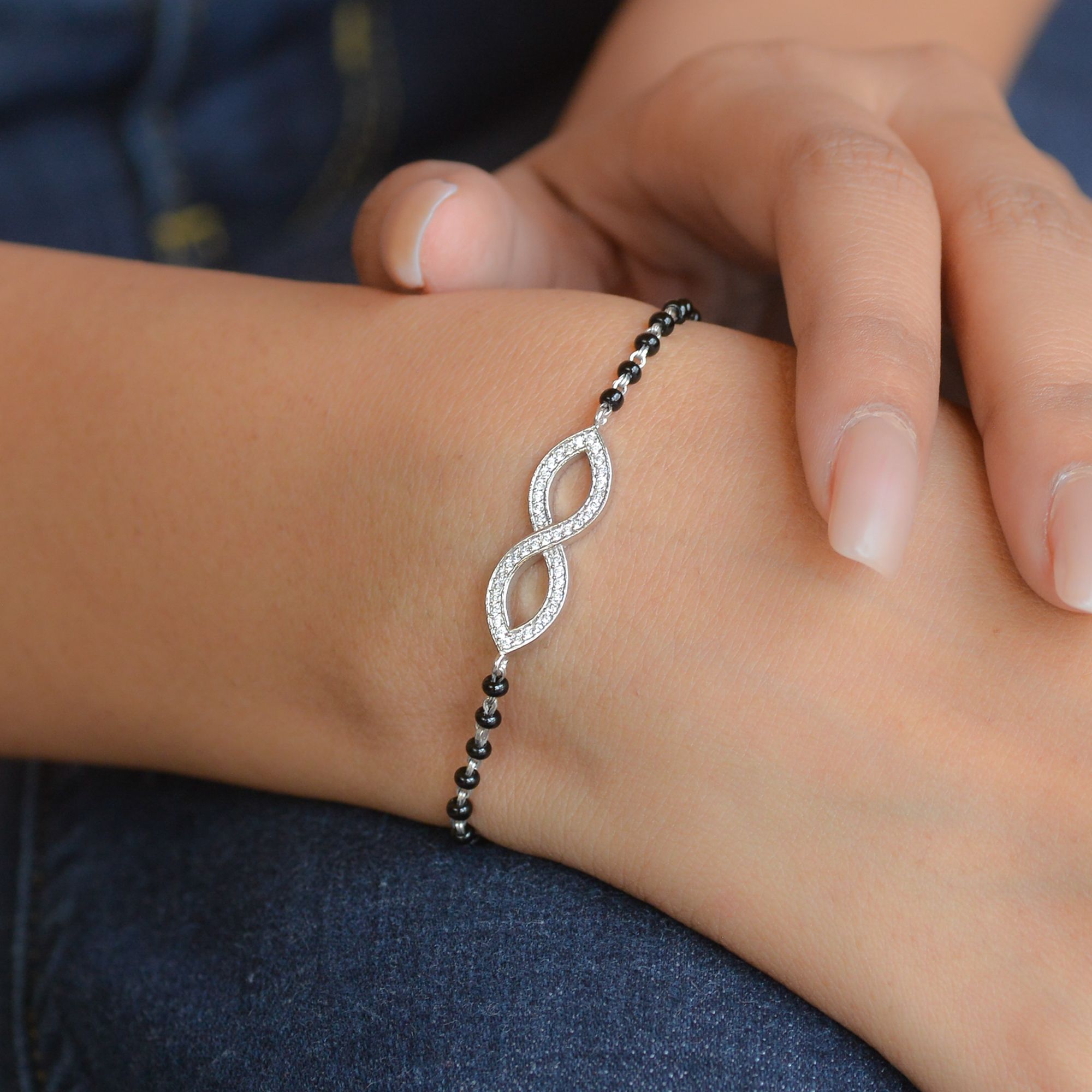 Close-up of a Delicate Silver Bracelet on Womans Wrist · Free Stock Photo