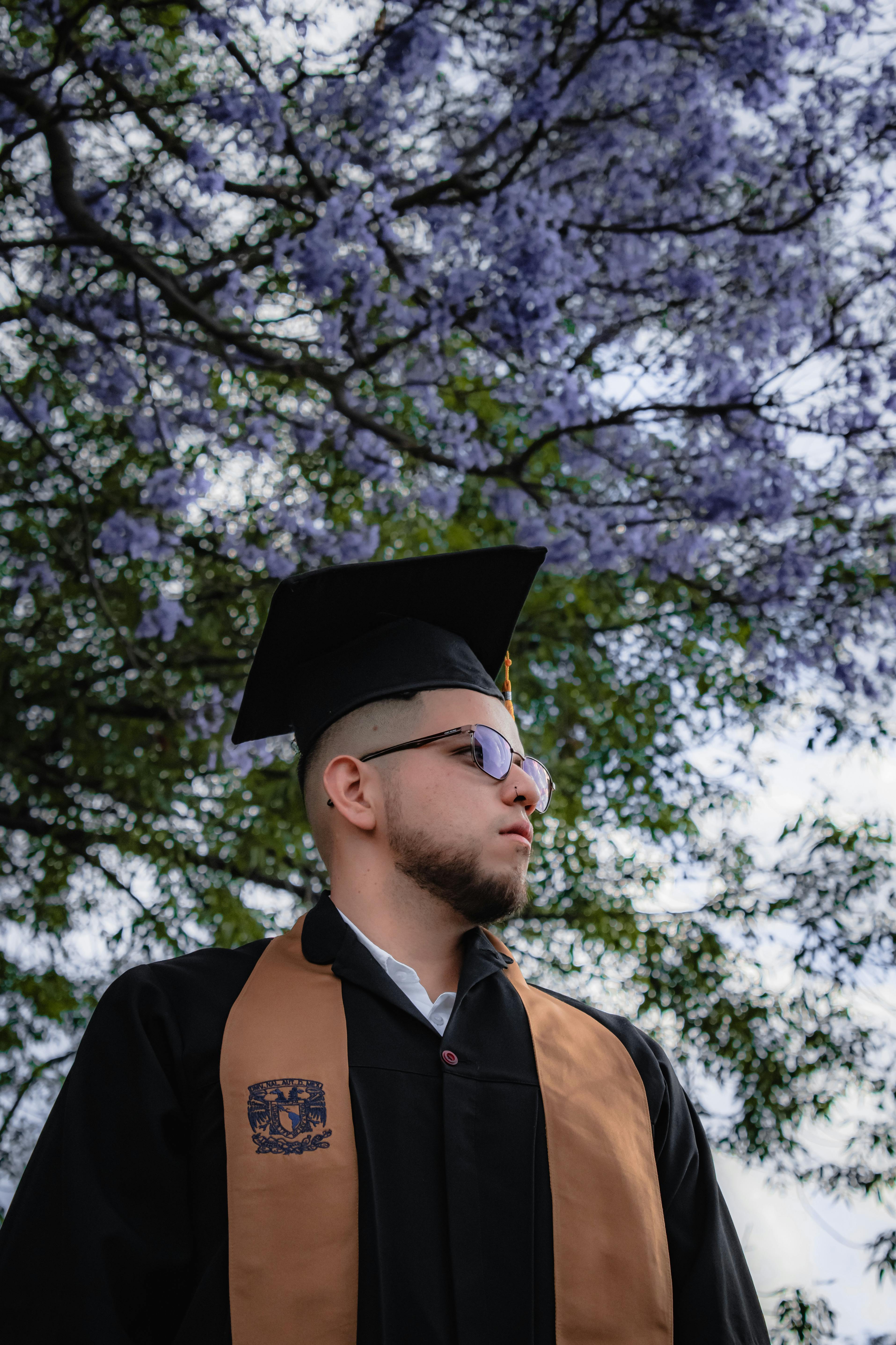 Photo of Man Wearing Graduation Cap · Free Stock Photo