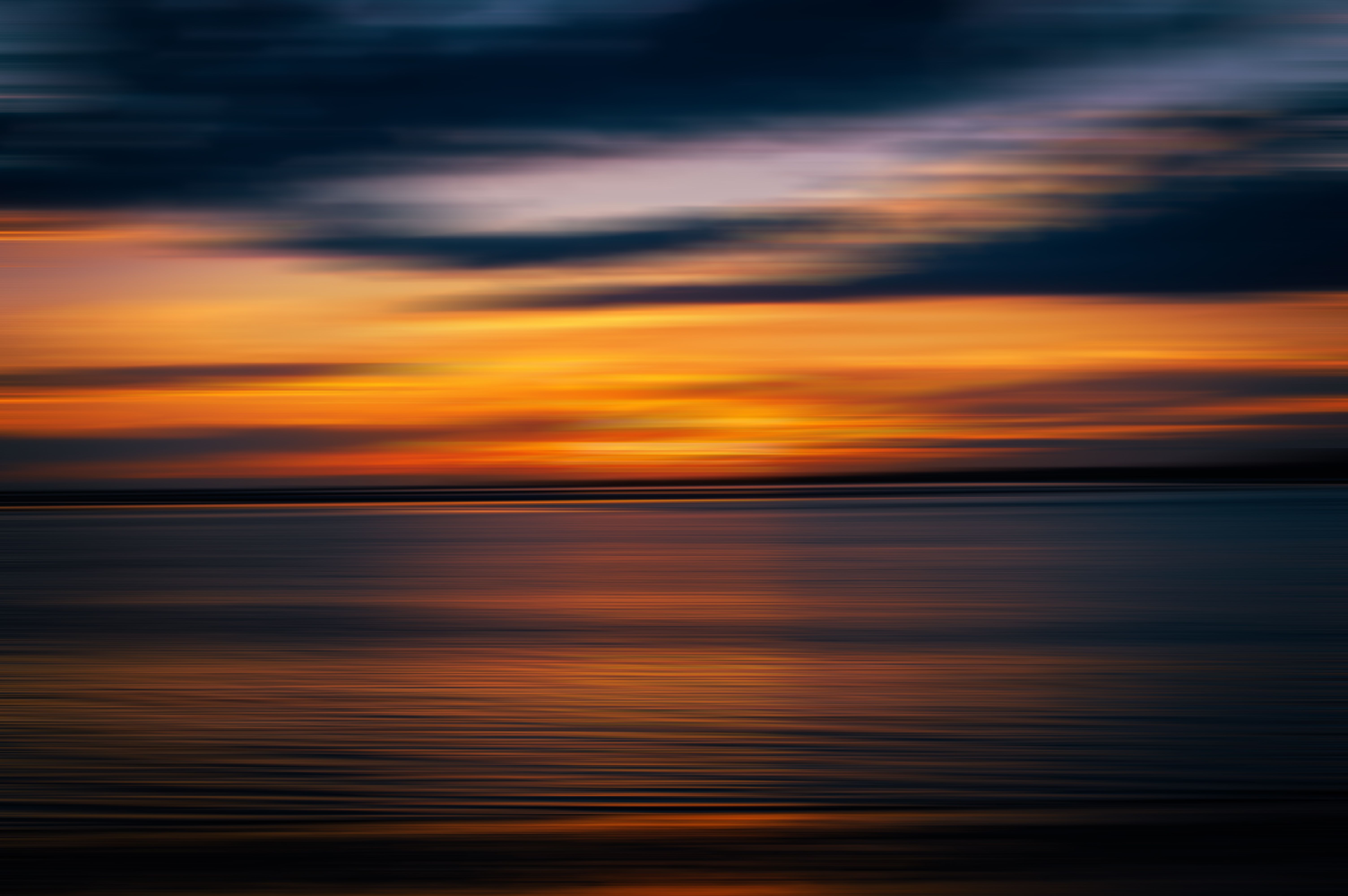 Blurry Picture of a Sunset over the Sea · Free Stock Photo