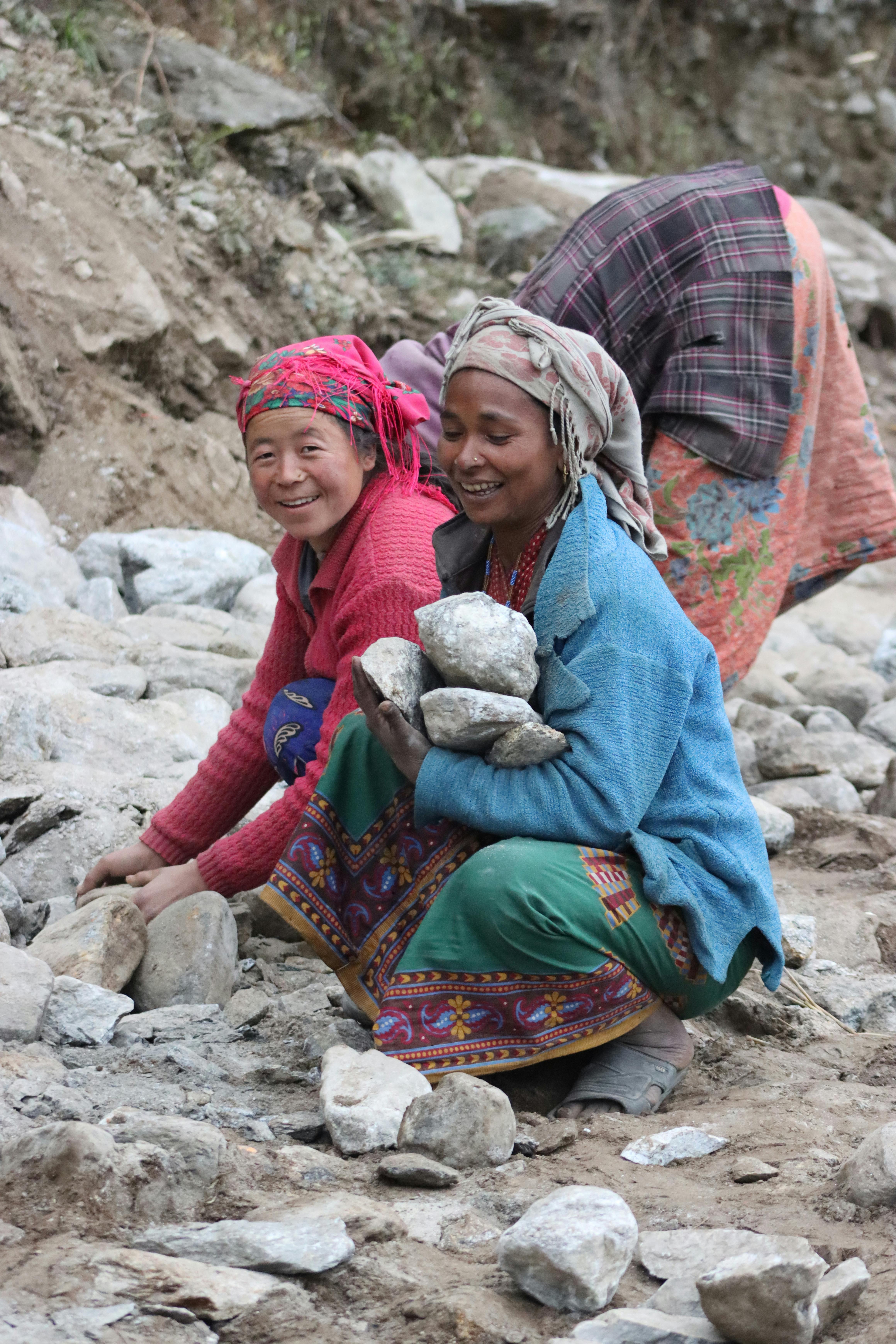 Women Picking up Rocks · Free Stock Photo