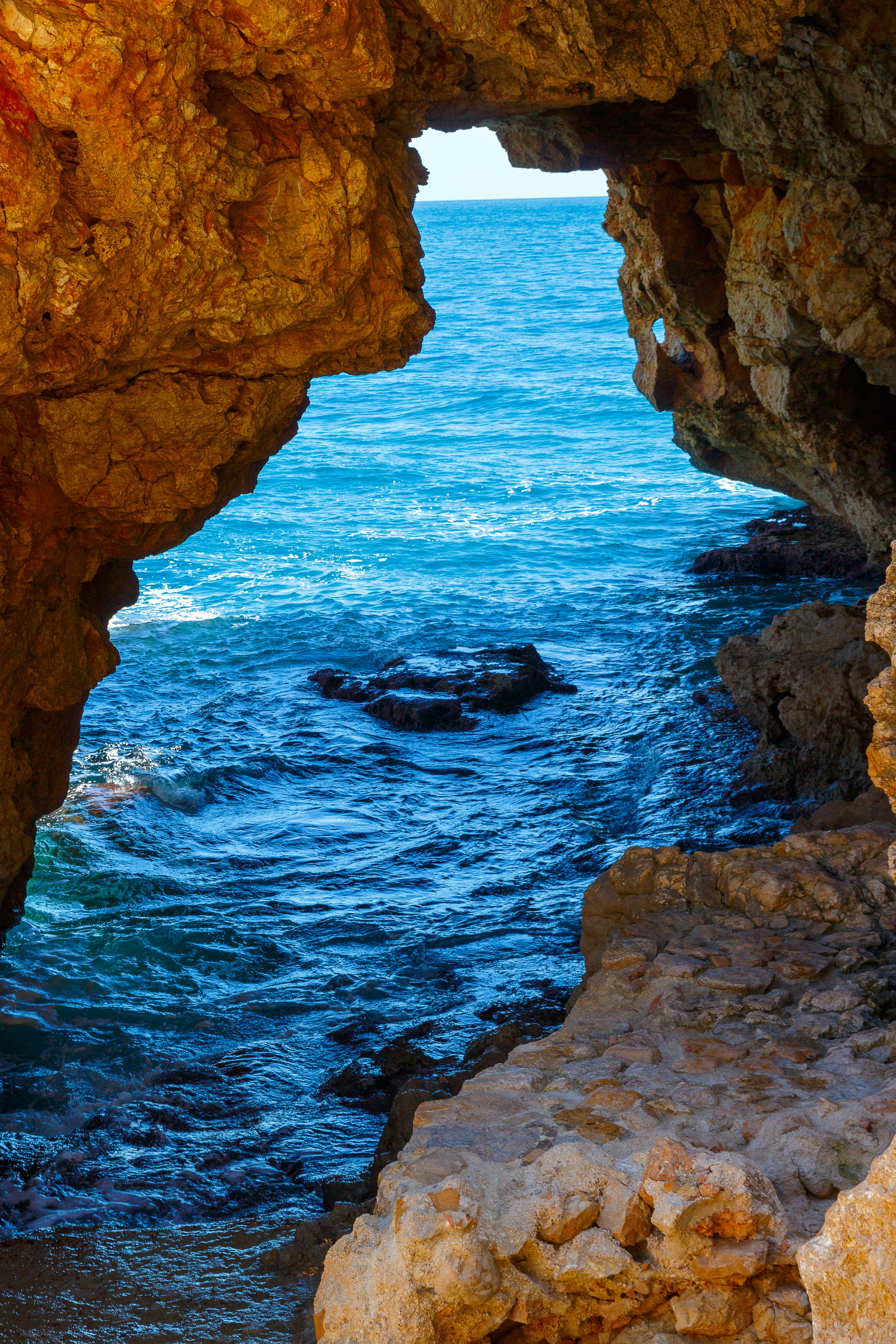 A Rocky Cave on the Seaside · Free Stock Photo