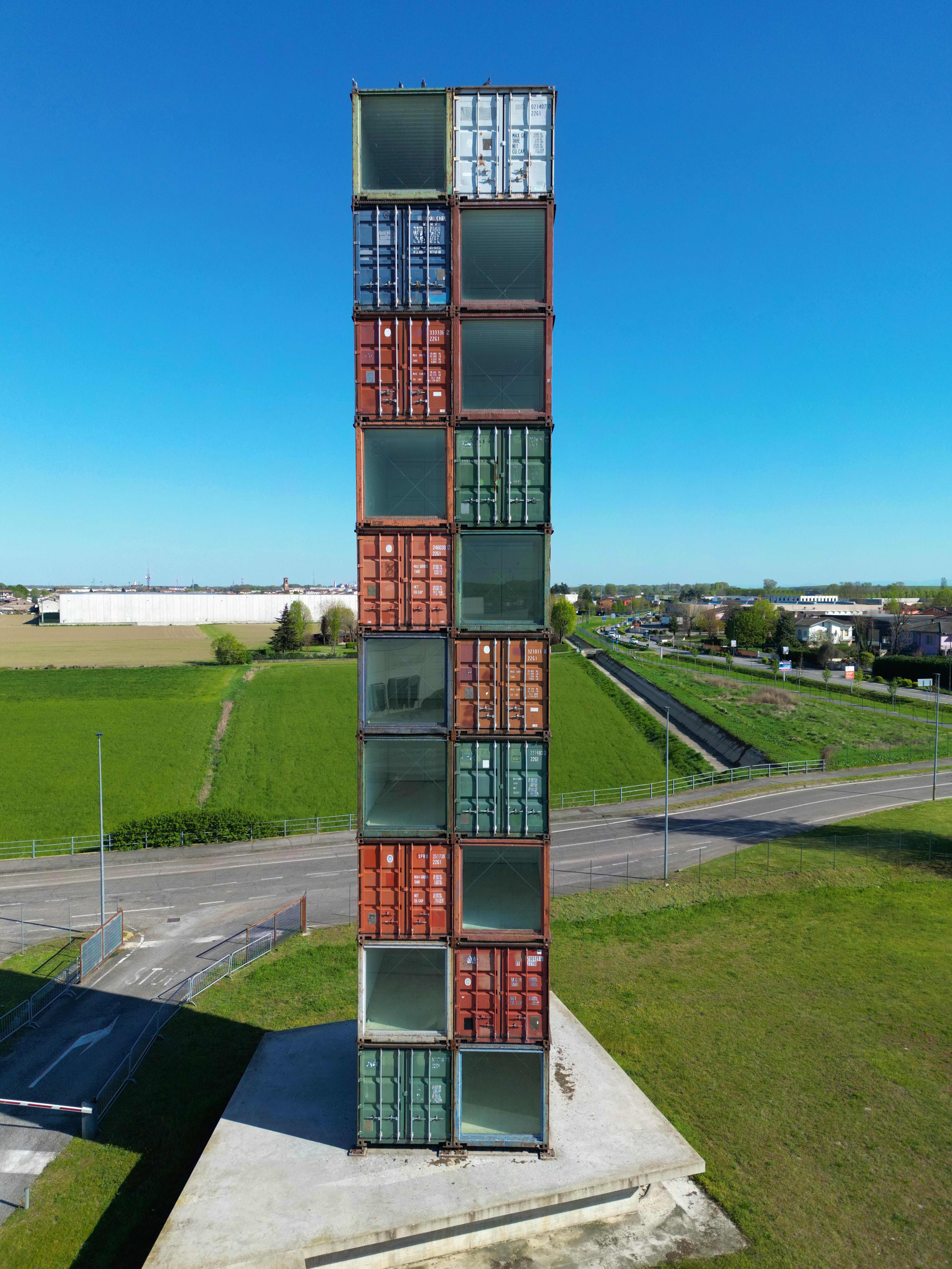 A tall tower made out of shipping containers · Free Stock Photo