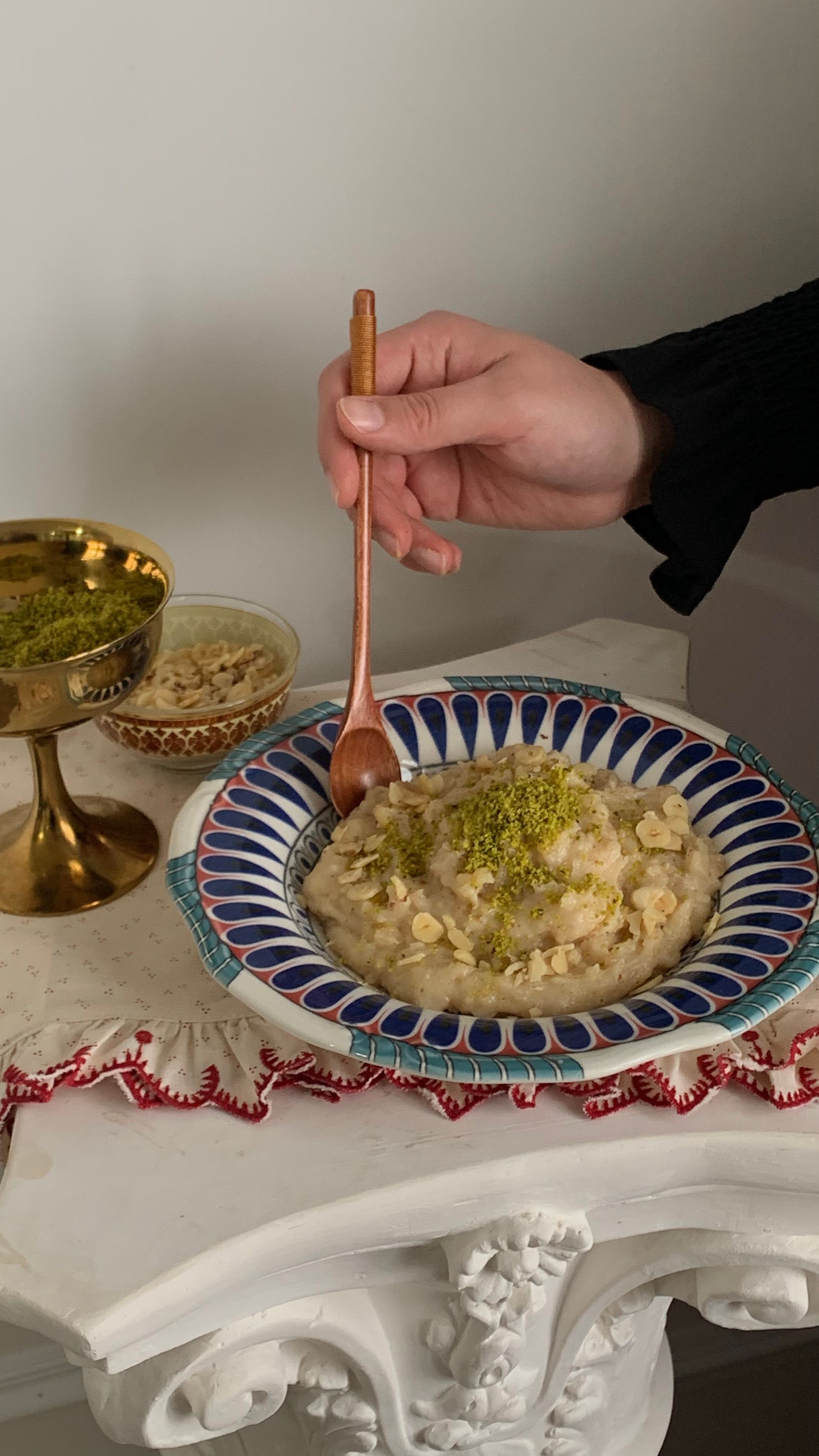 Hand with Spoon over Plate with Meal · Free Stock Photo