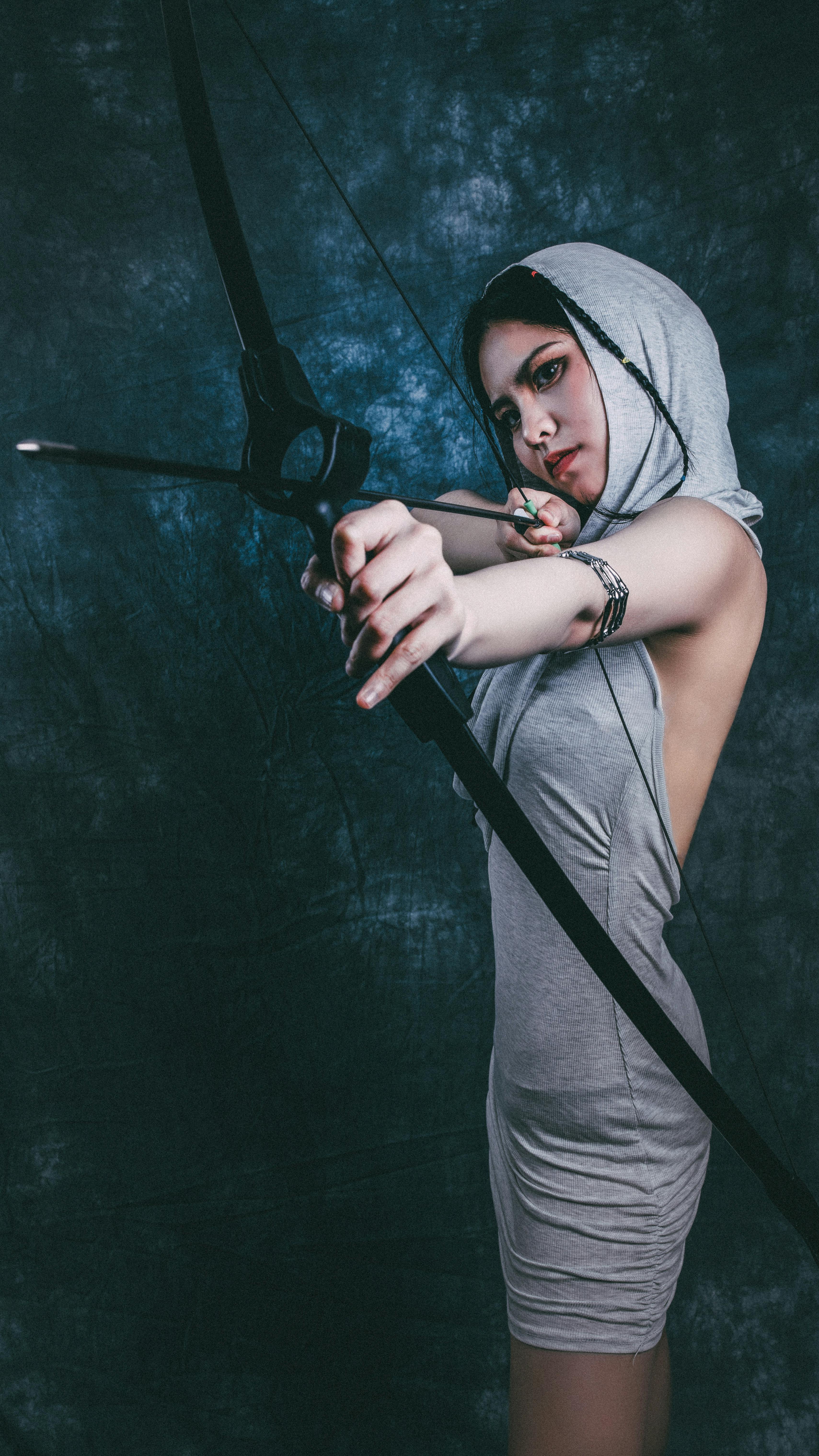 Woman Posing with Bow · Free Stock Photo