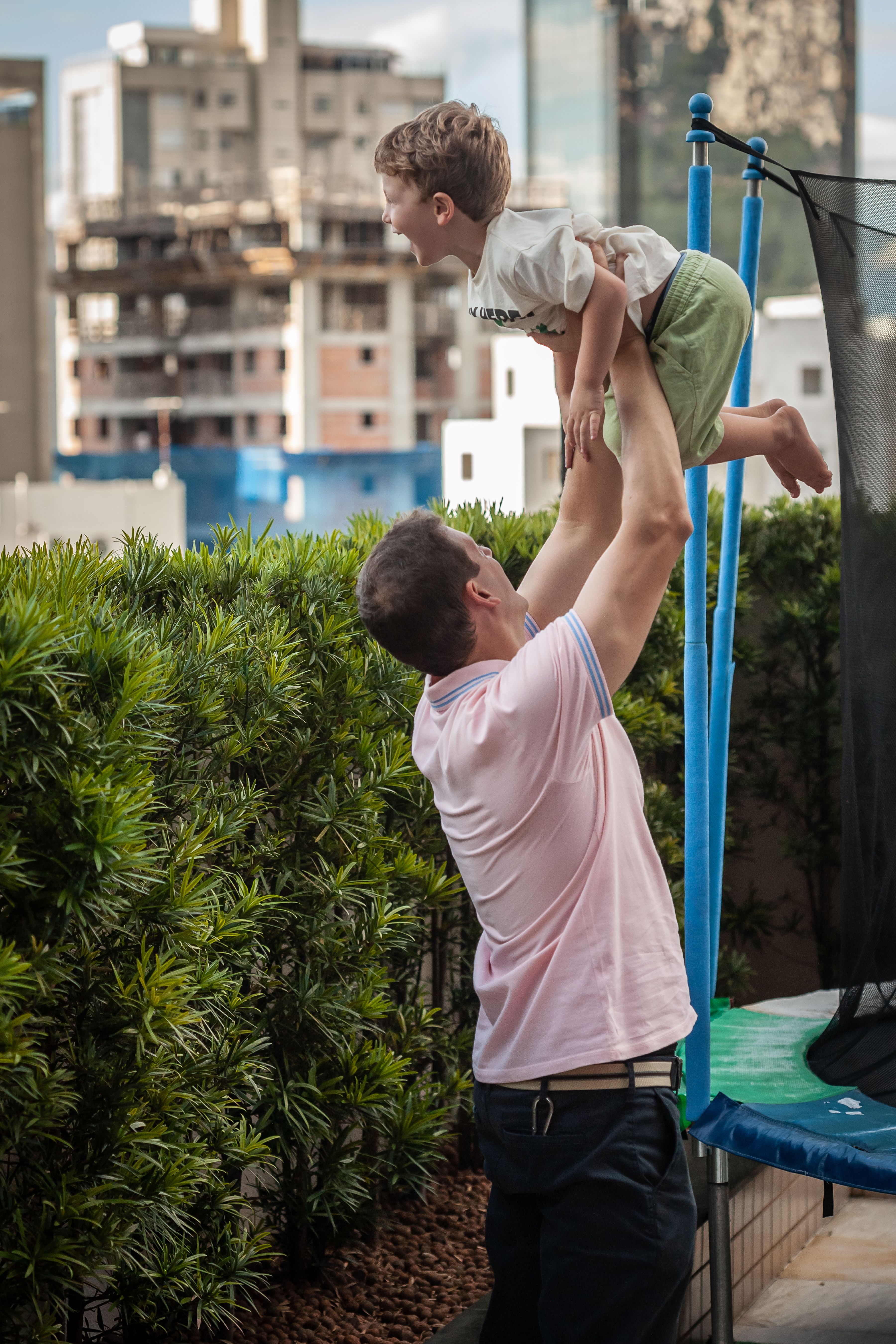Father Standing and Holding Sun · Free Stock Photo