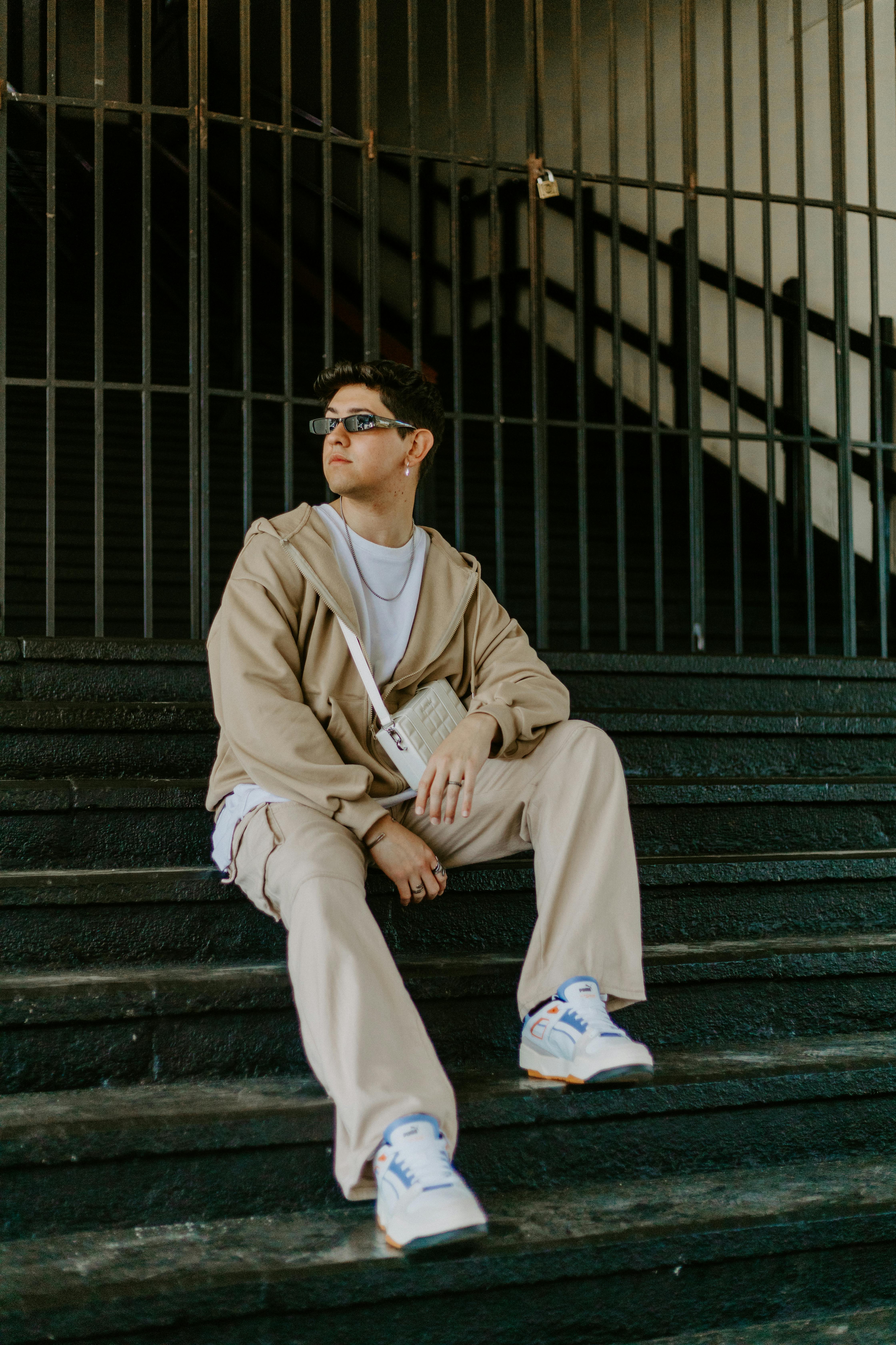 Fashionable Young Man Sitting on Steps · Free Stock Photo