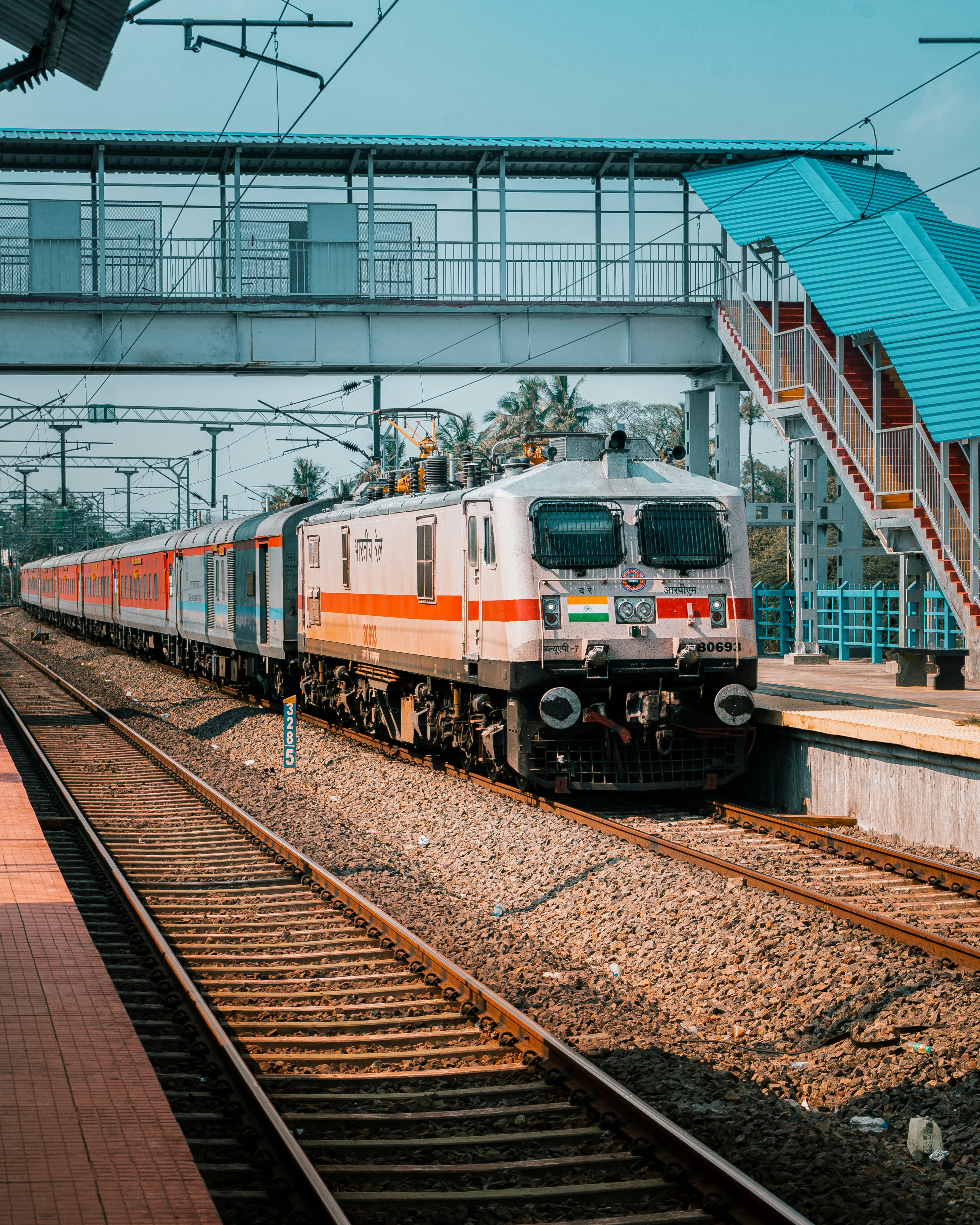 Train on Railway Riding Through a Forest · Free Stock Photo