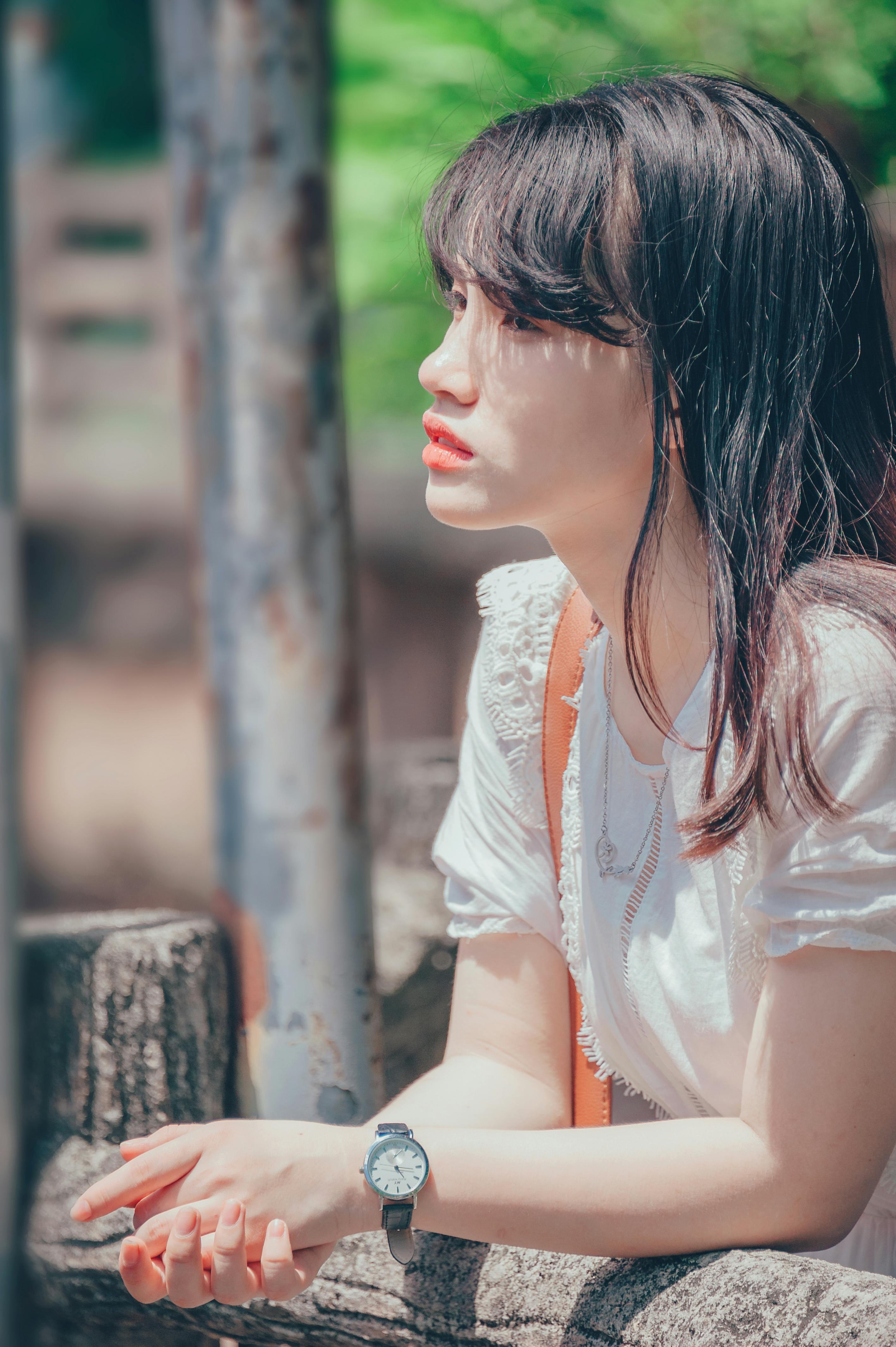 Woman Leaning On Railing · Free Stock Photo