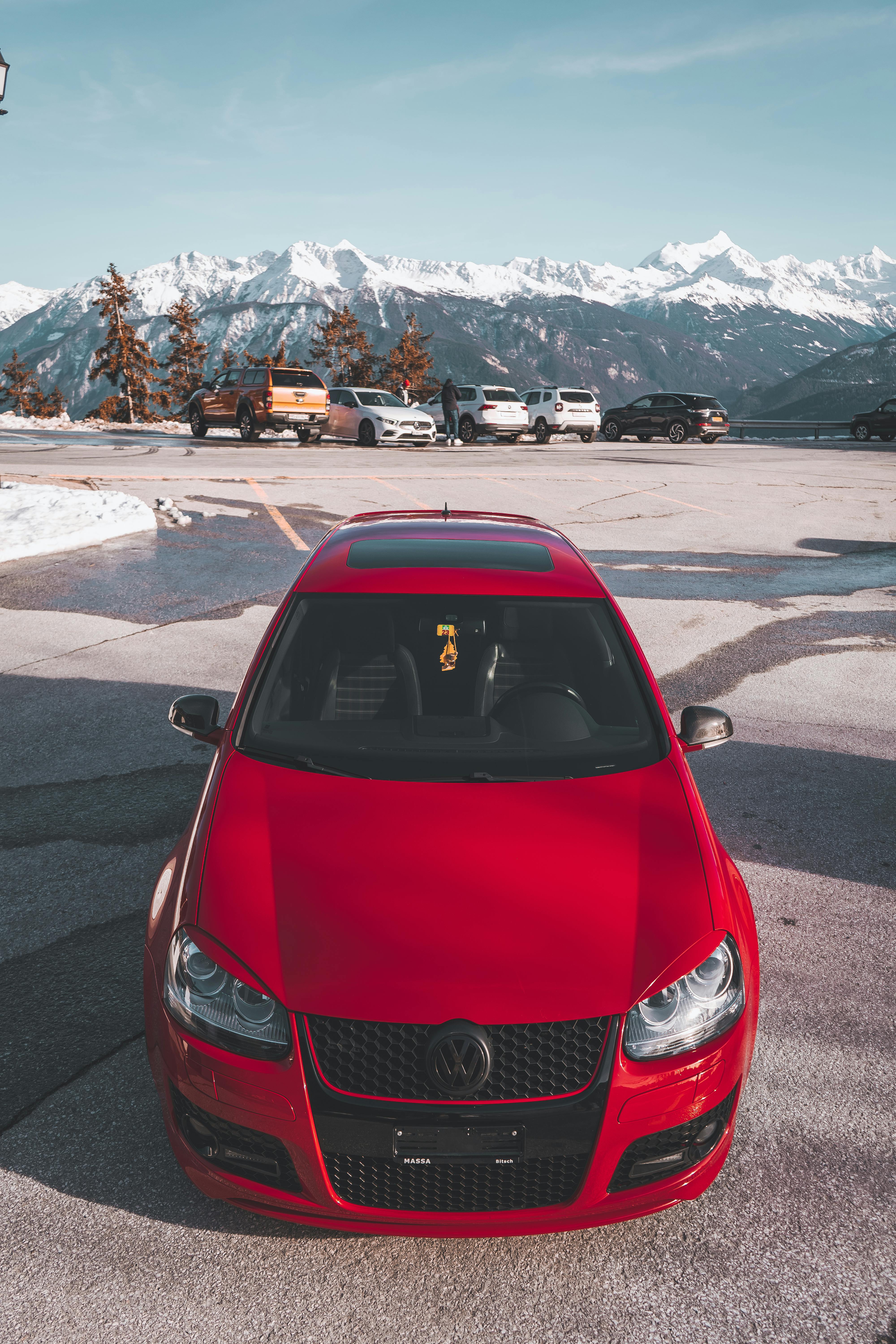 Red Car on a Parking Lot · Free Stock Photo