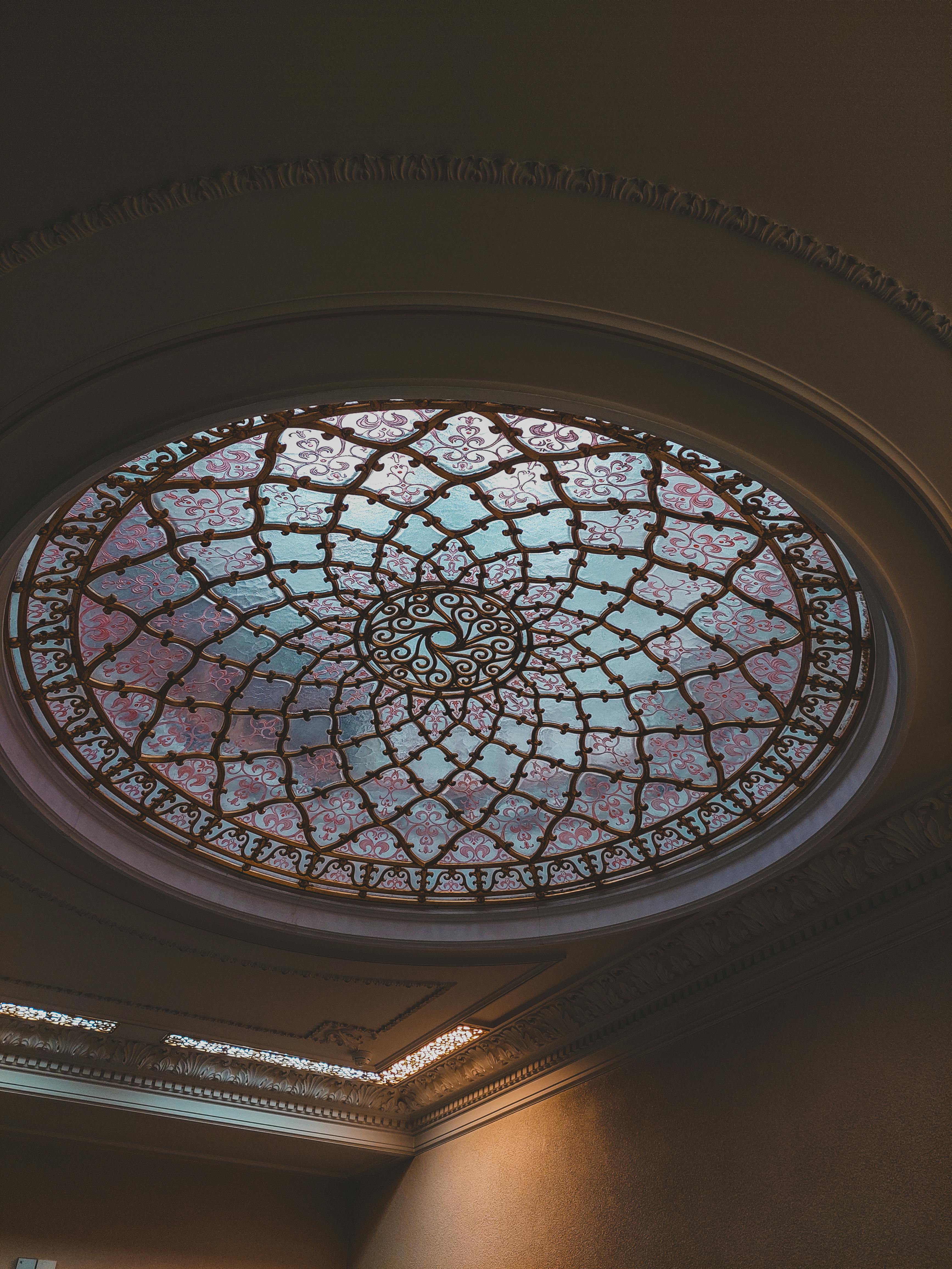 A Ceiling with a Stained Glass Rosette · Free Stock Photo