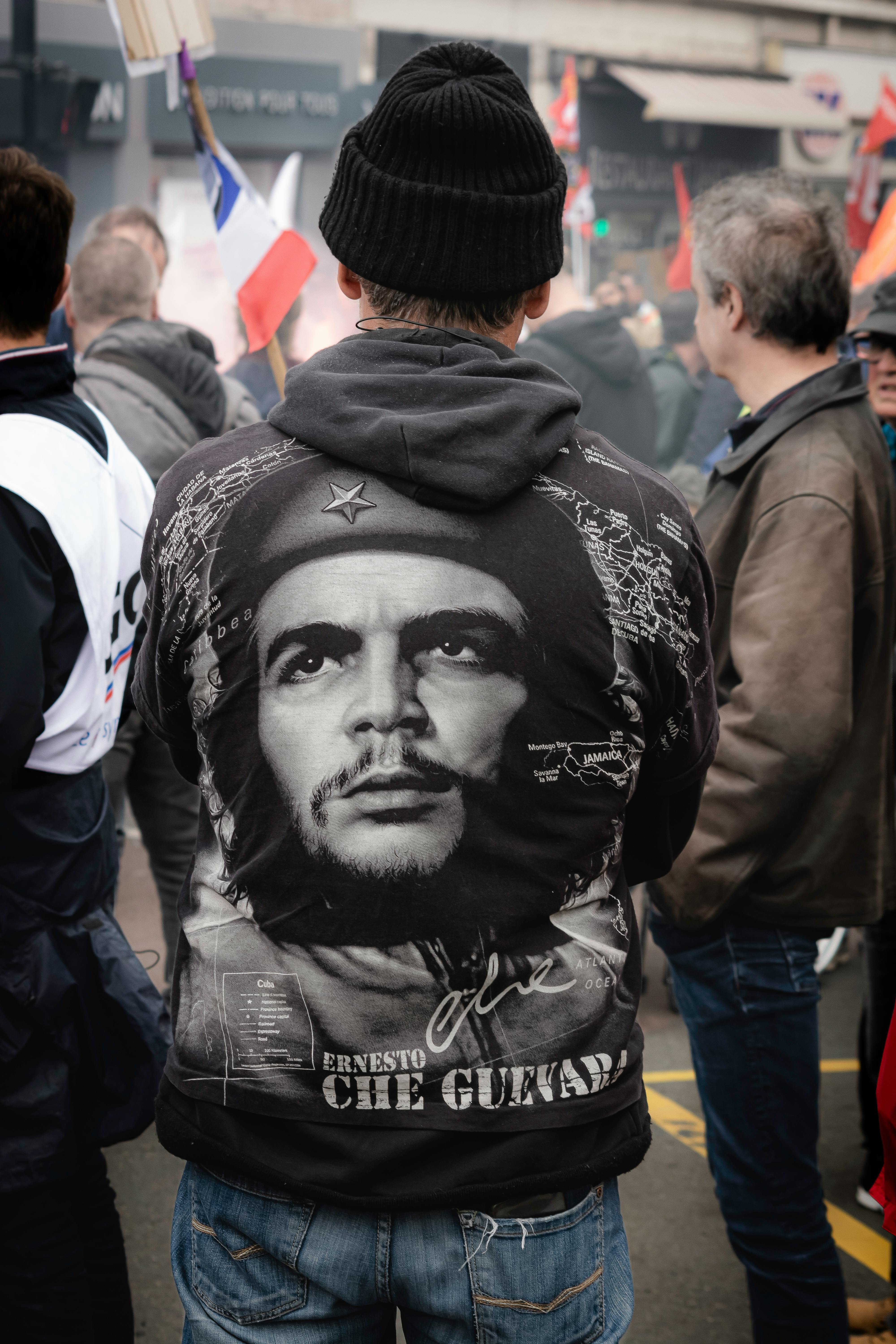 Man in Hoodie with Che Guevara Portrait on Back · Free Stock Photo