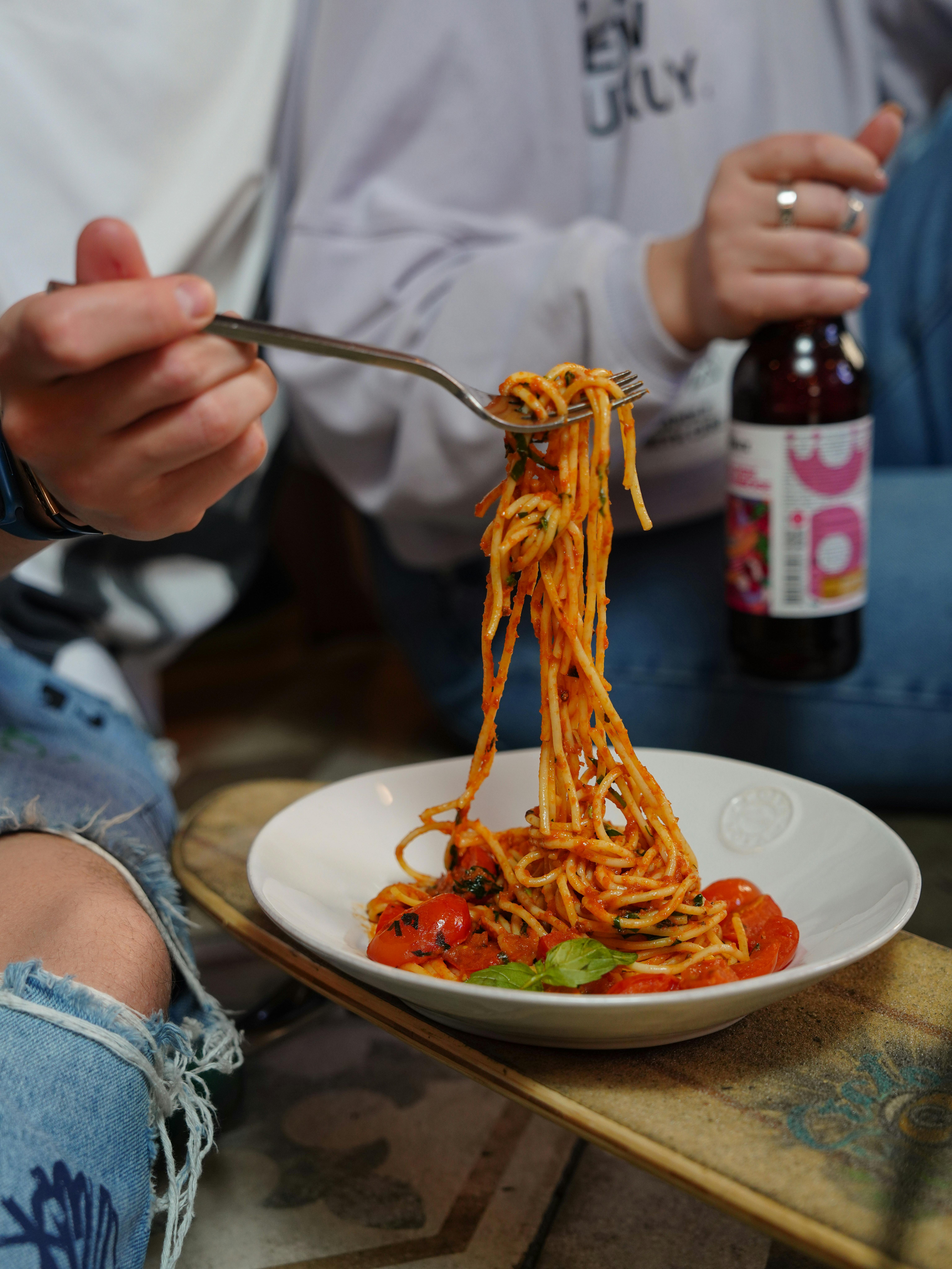 Couple Sharing a Spaghetti · Free Stock Photo