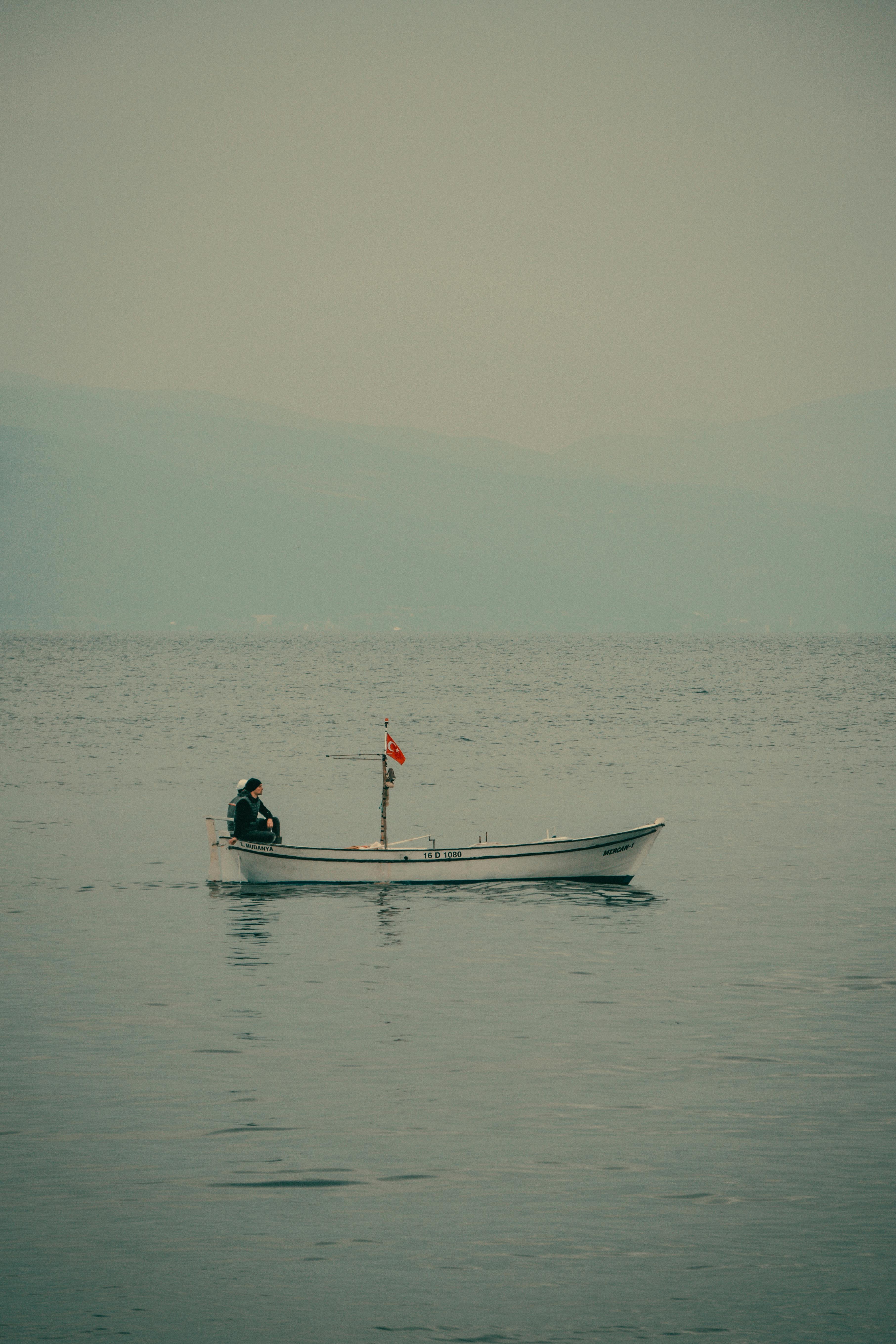 Men in the Boat at Sea · Free Stock Photo