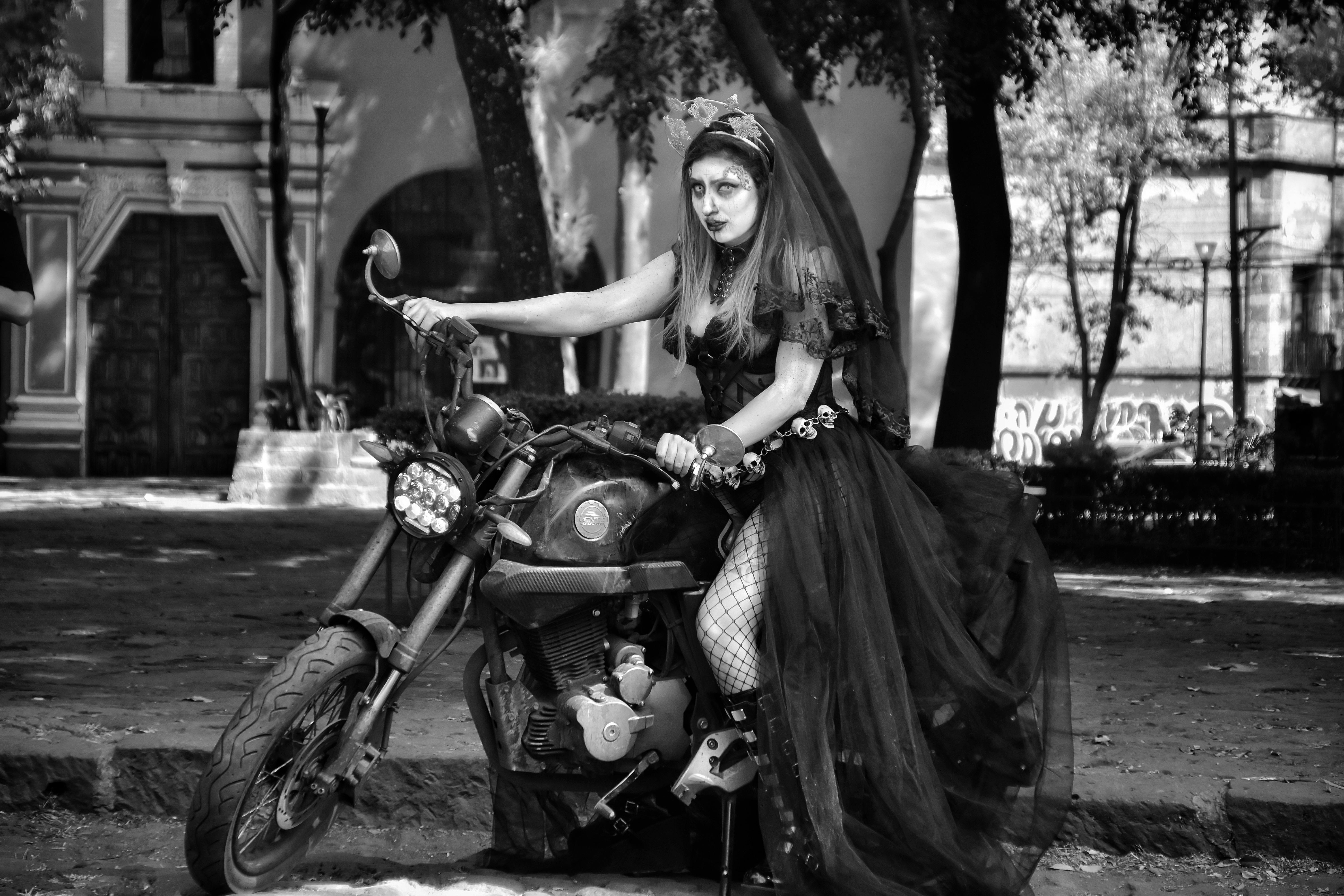 Woman in a Costume Riding on a Motorcycle · Free Stock Photo