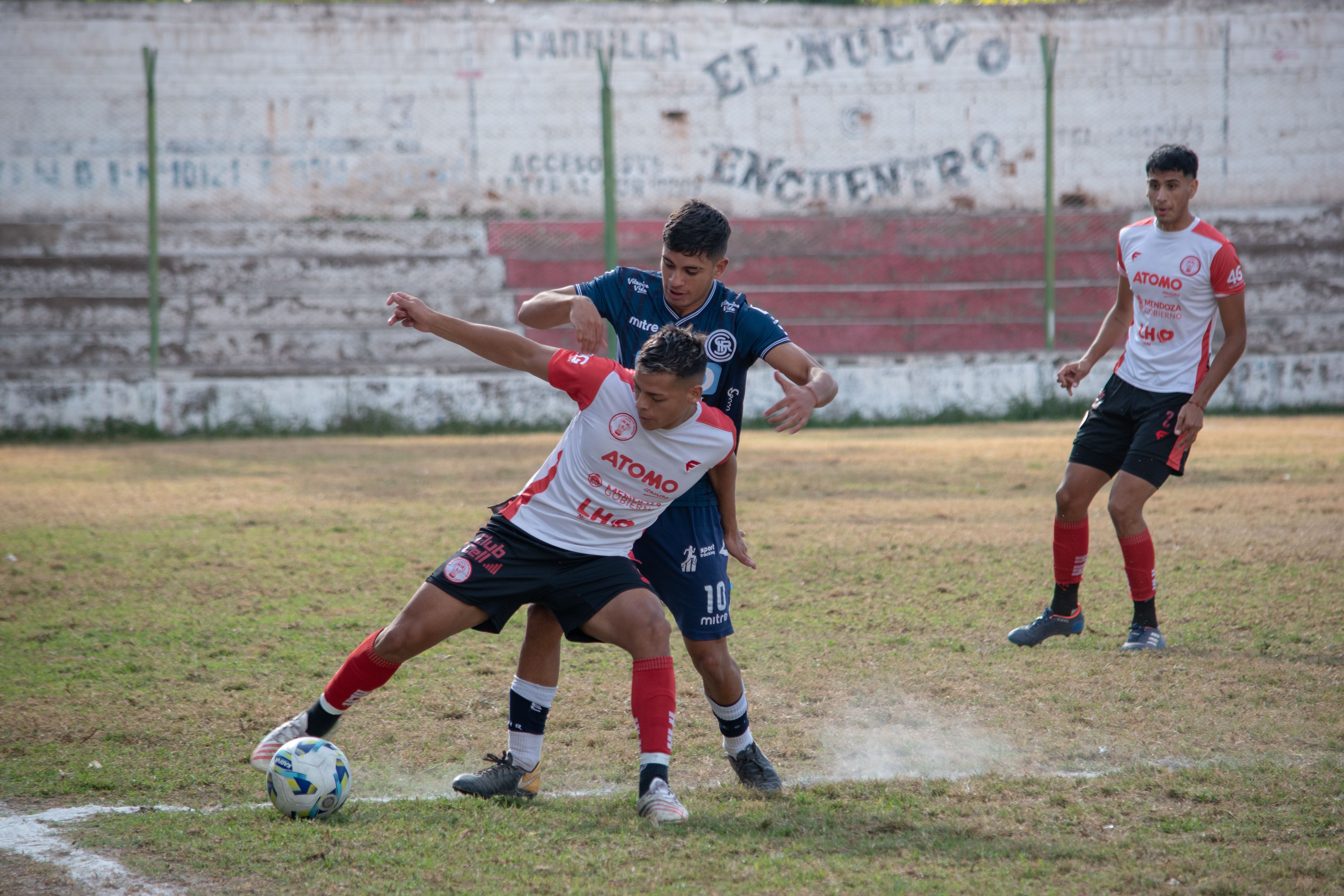 Men Playing Football on a Field · Free Stock Photo