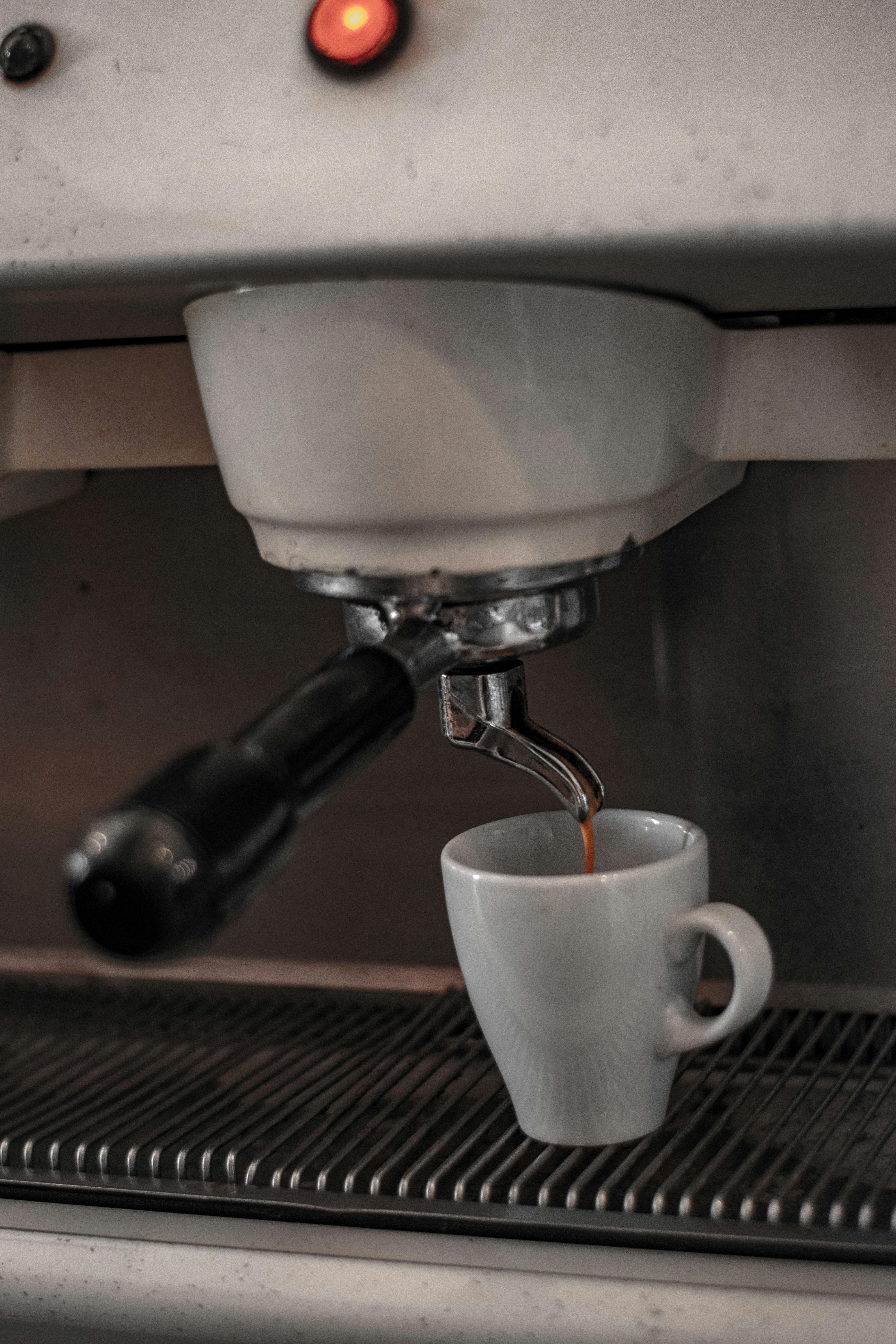 Espresso Machine Extracting Coffee and Dripping in White Cup · Free ...