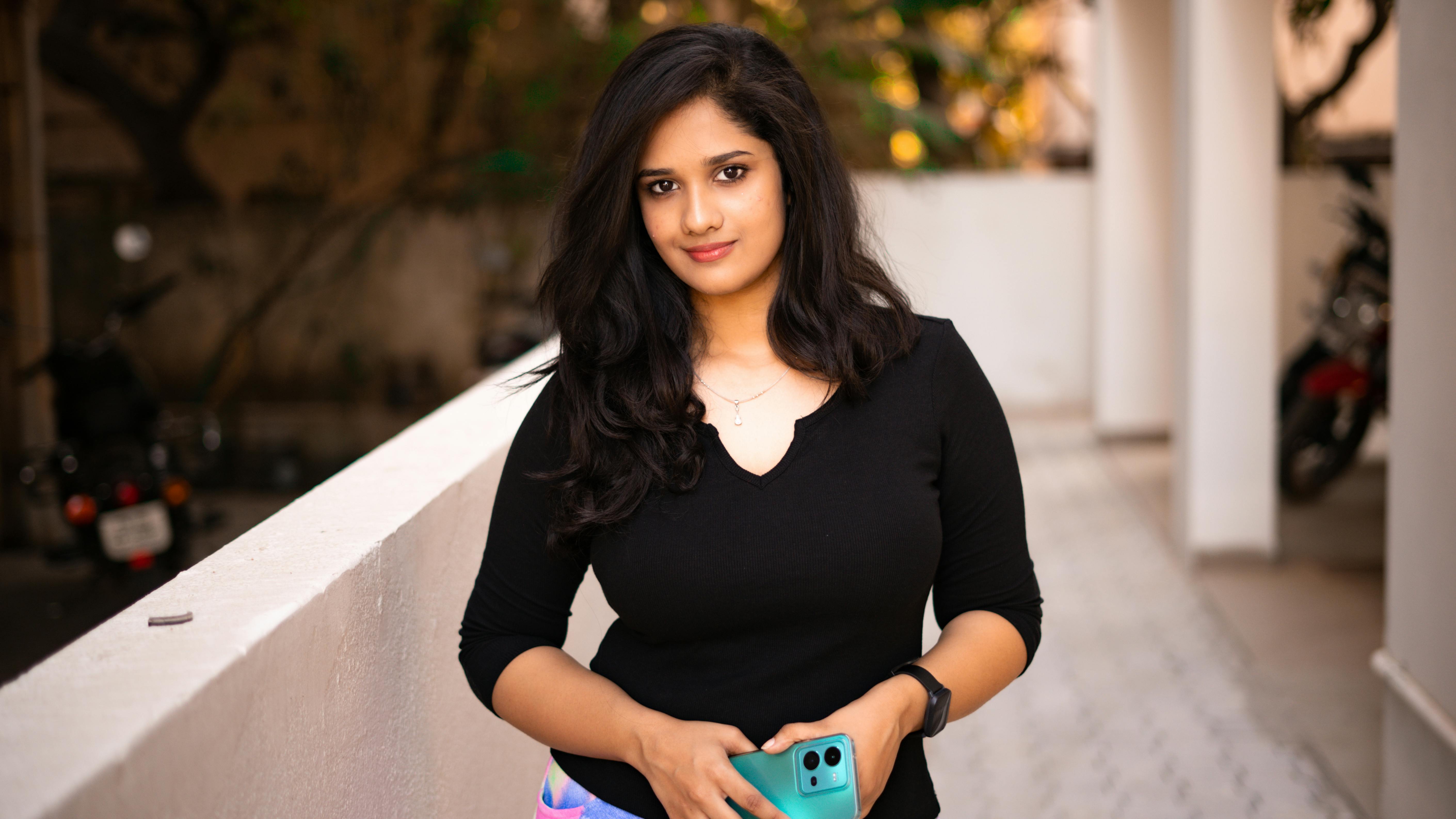 Portrait of Woman in Orange Clothes · Free Stock Photo