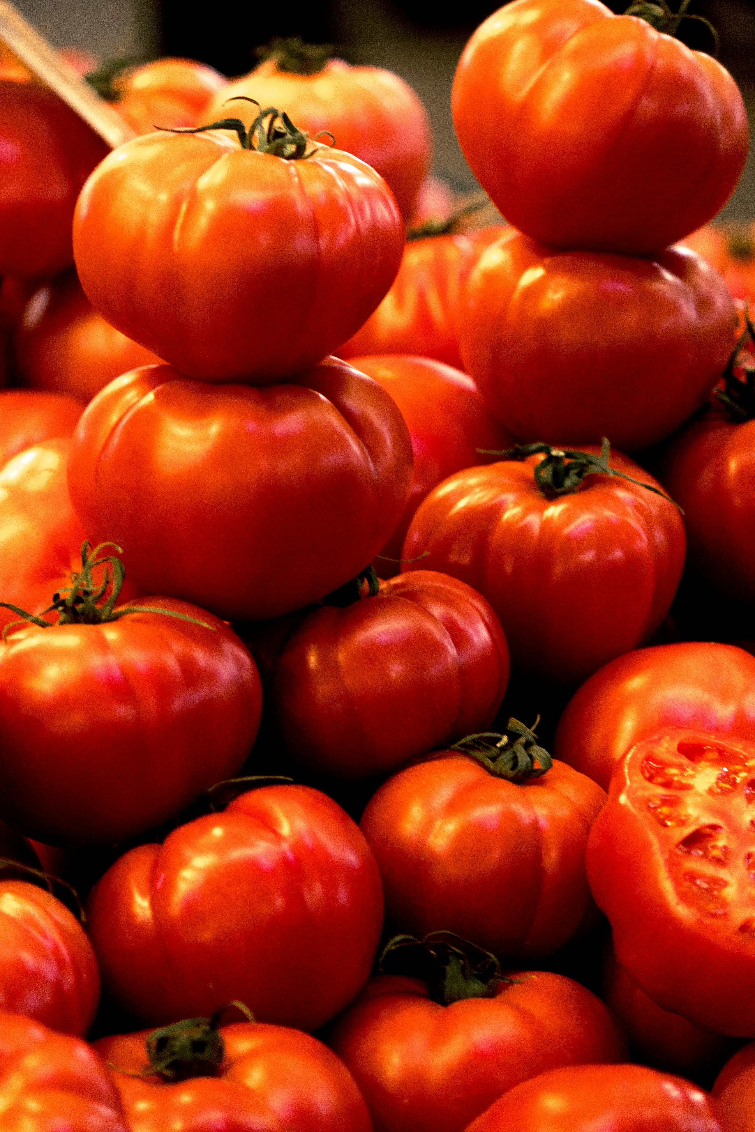 Close-up of Tomatoes on Wooden Table · Free Stock Photo