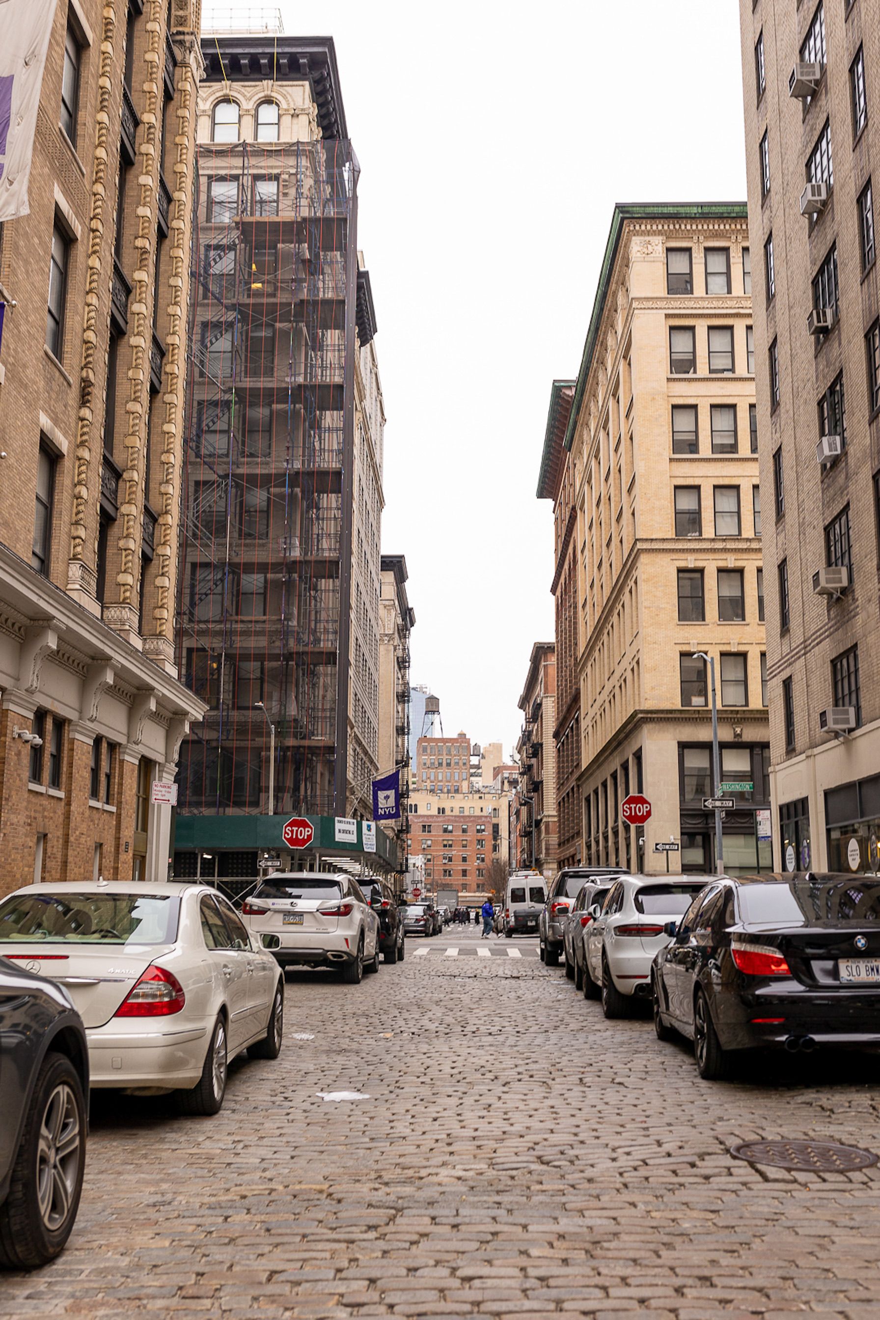 Cobblestone Street between Buildings in City · Free Stock Photo