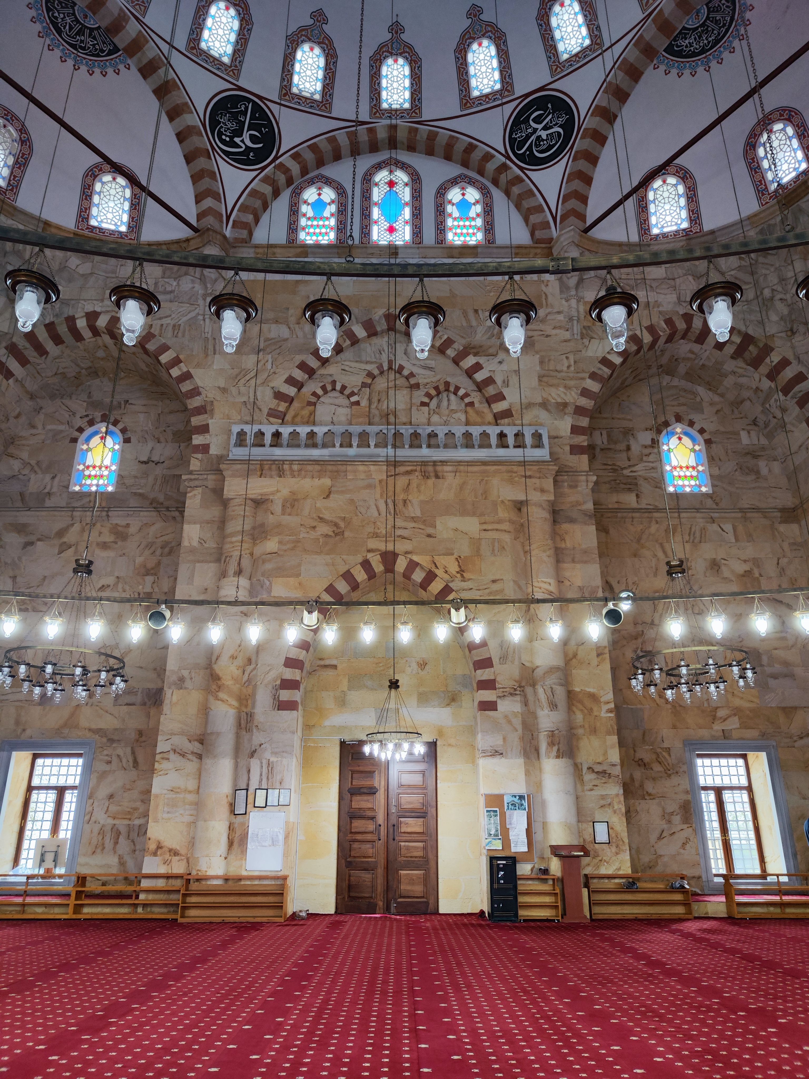 Woman in Traditional Clothing Sitting in Mosque · Free Stock Photo