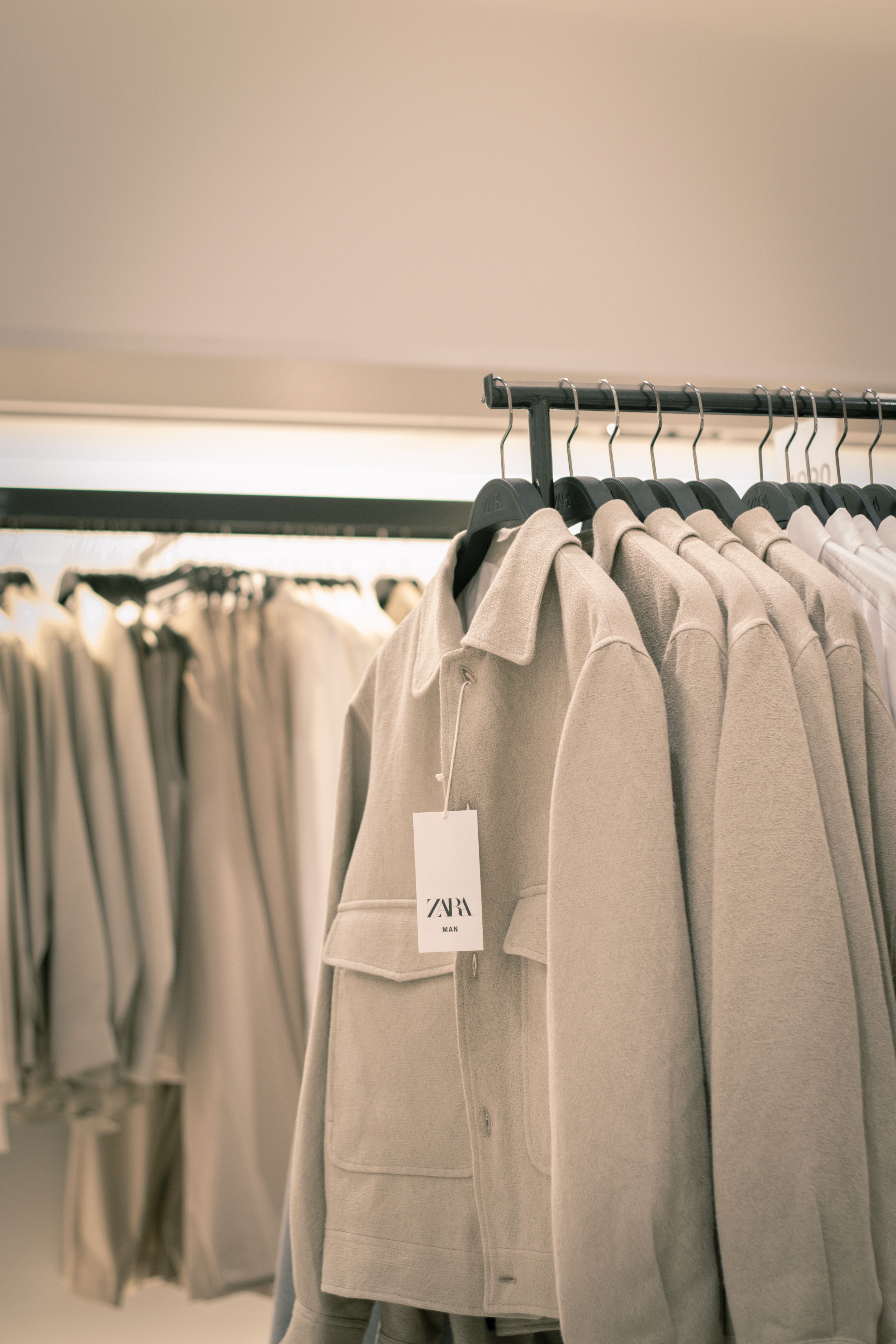Clothes on Hangers Hanging on Clothing Racks · Free Stock Photo