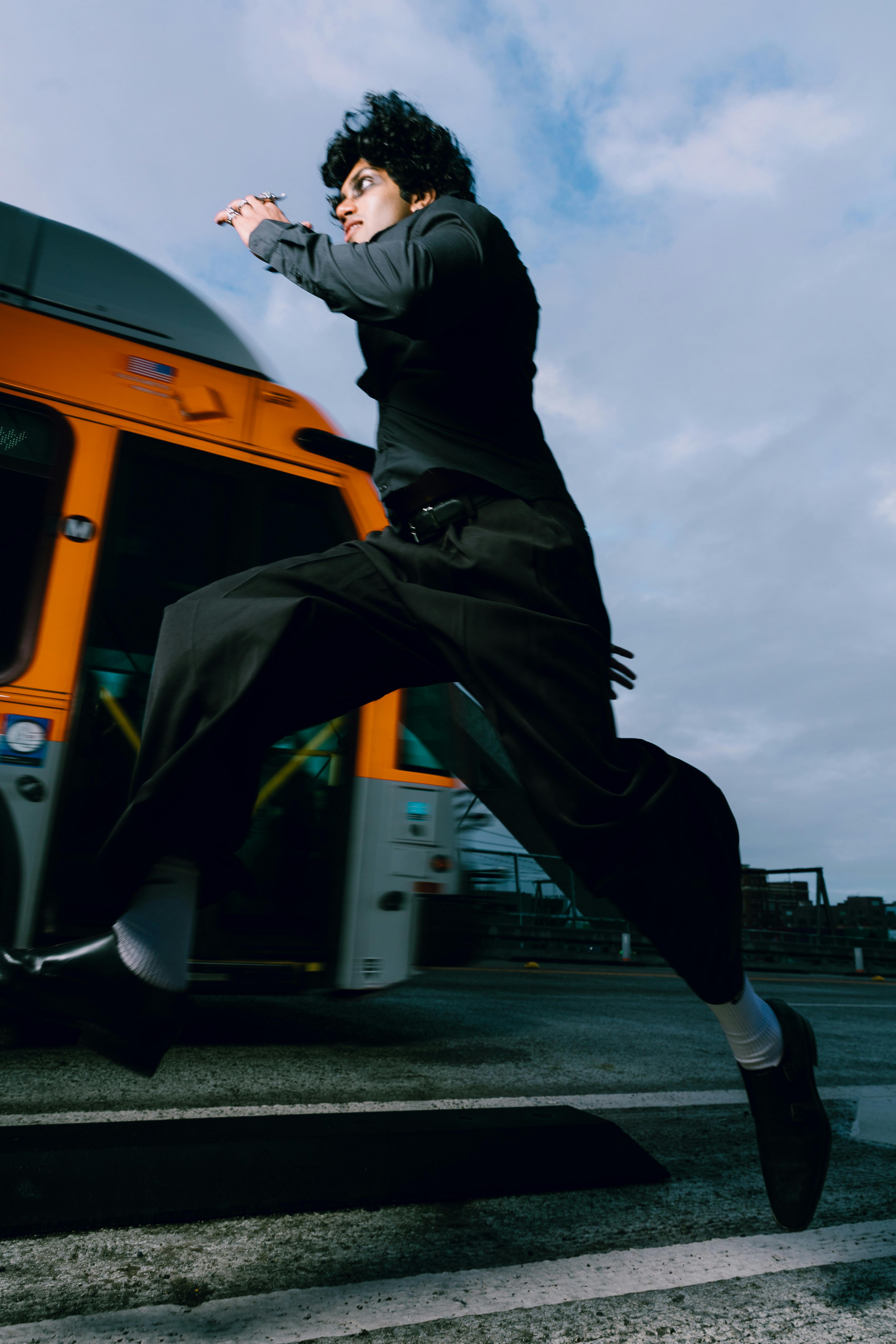 Man Running near Bus on Street · Free Stock Photo