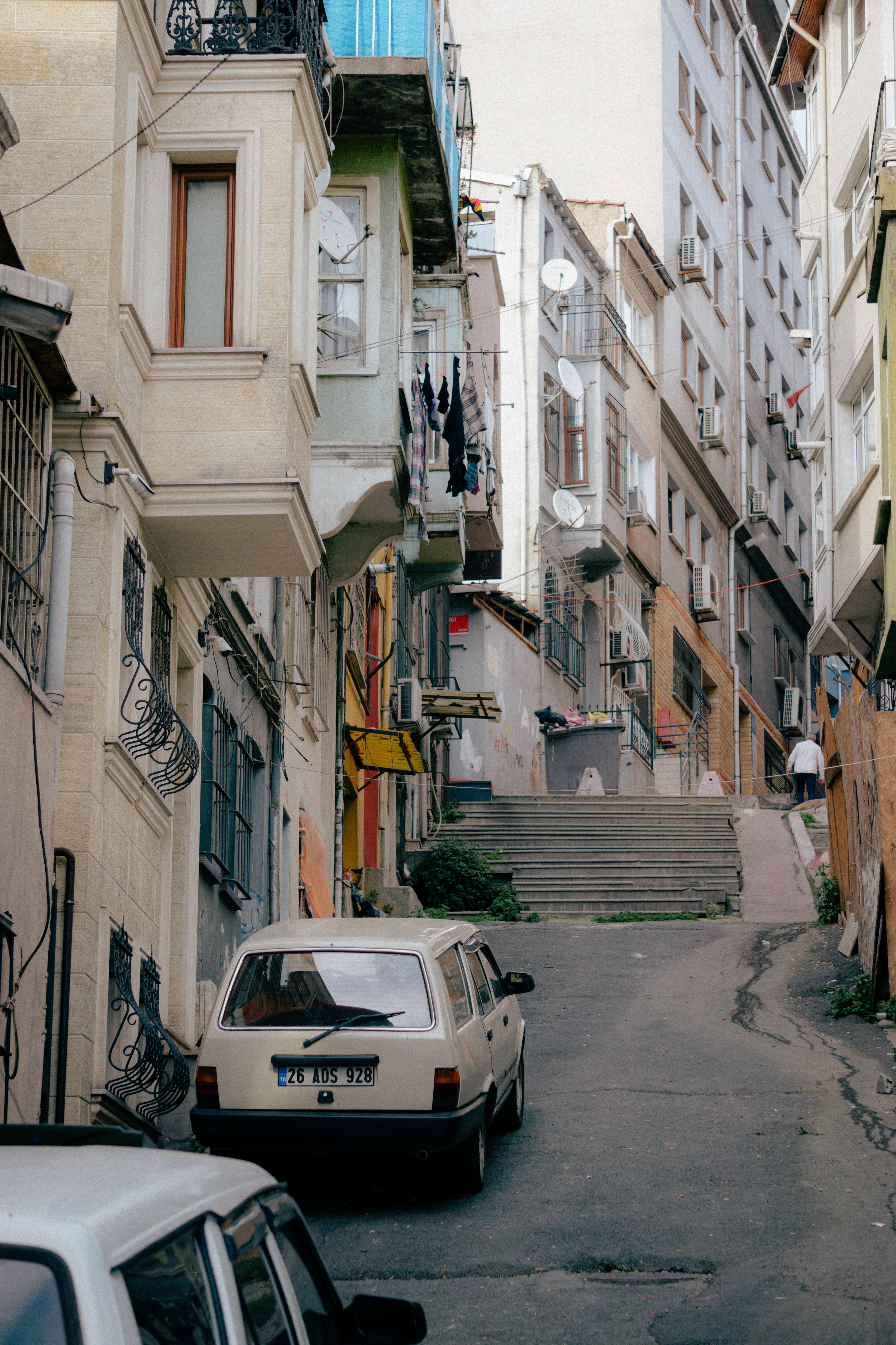 View of a Street between Residential Buildings in City · Free Stock Photo