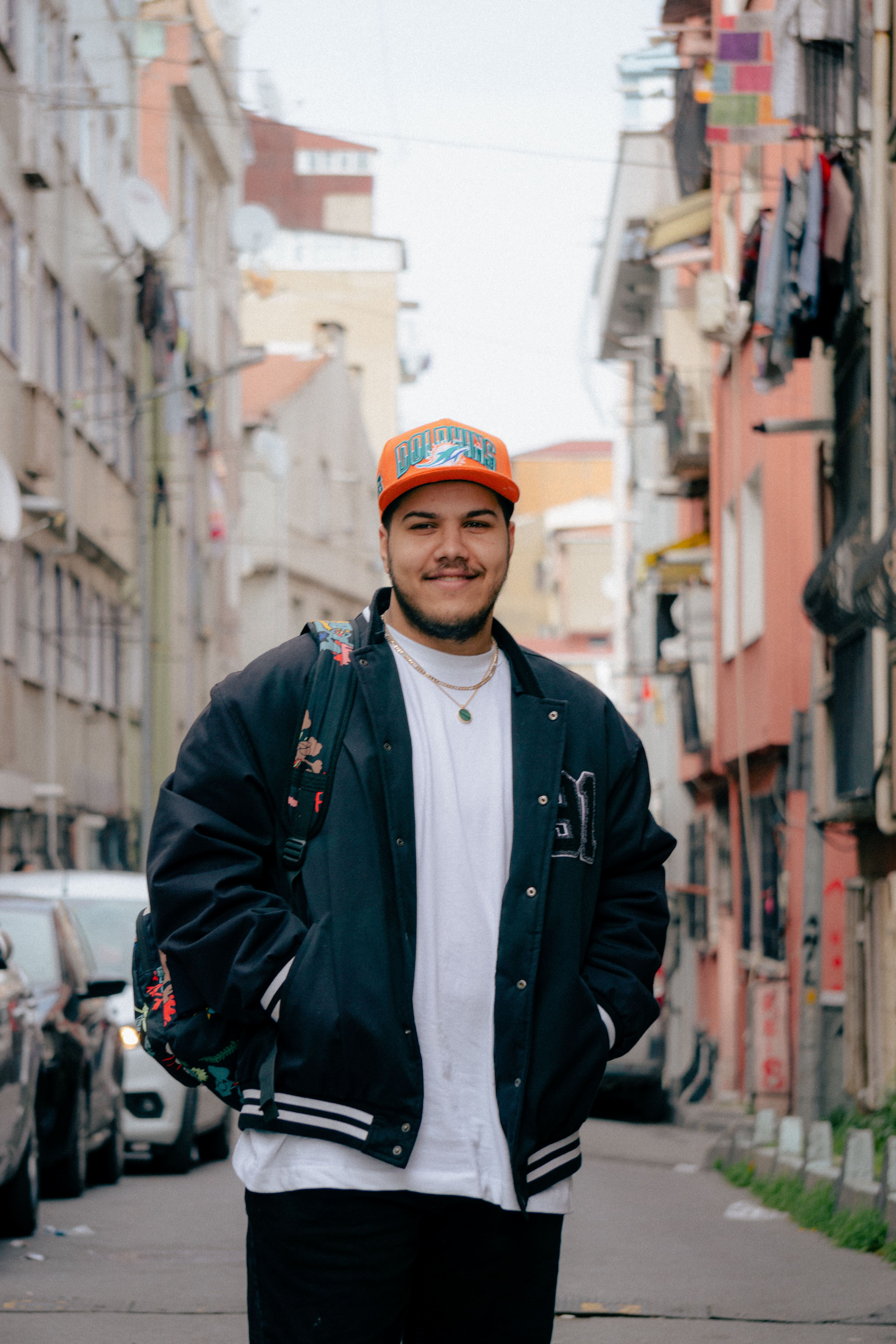 Man in Cap and Jacket on Street · Free Stock Photo