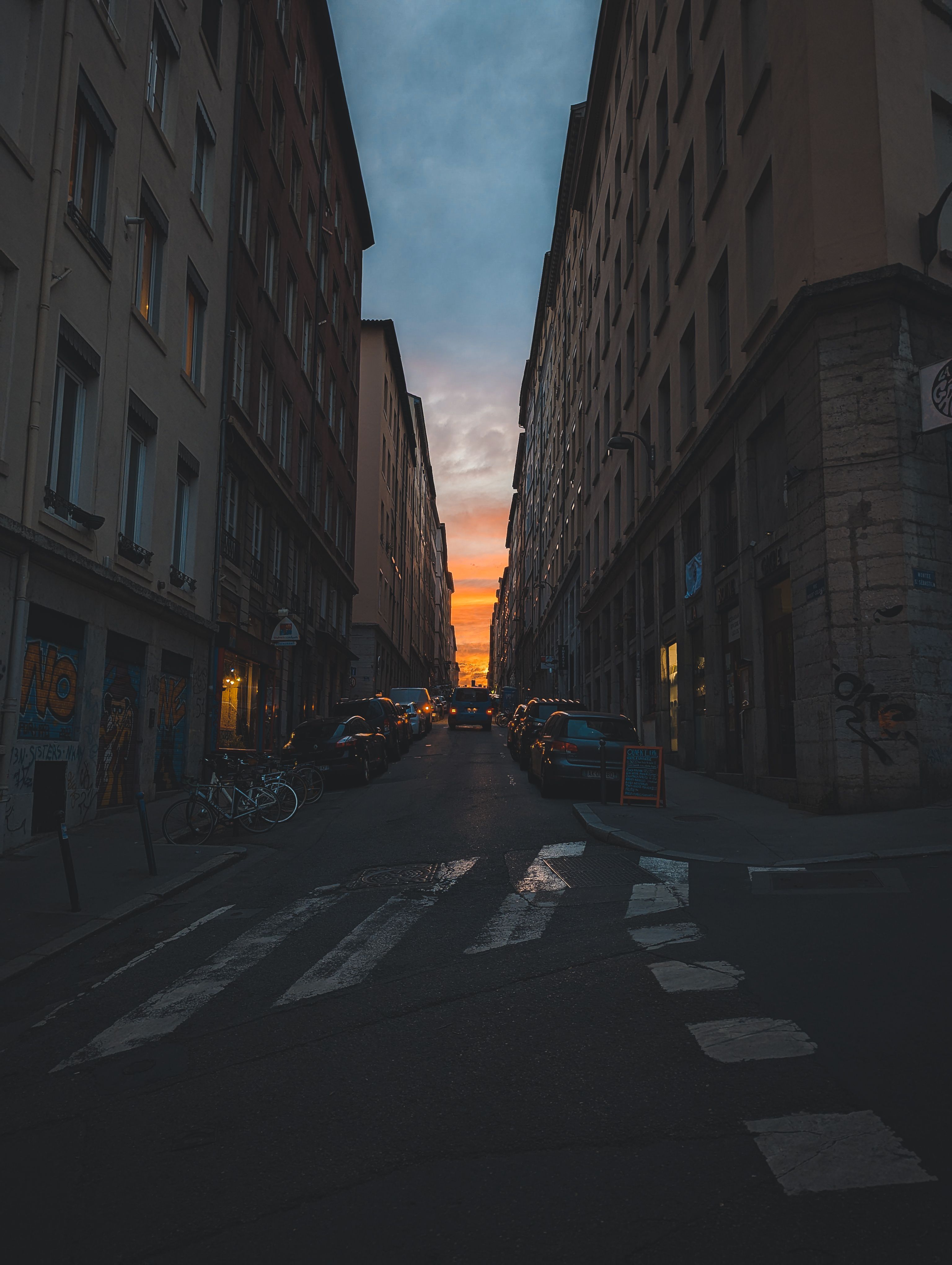 Narrow Street in a City under a Dramatic Sky · Free Stock Photo