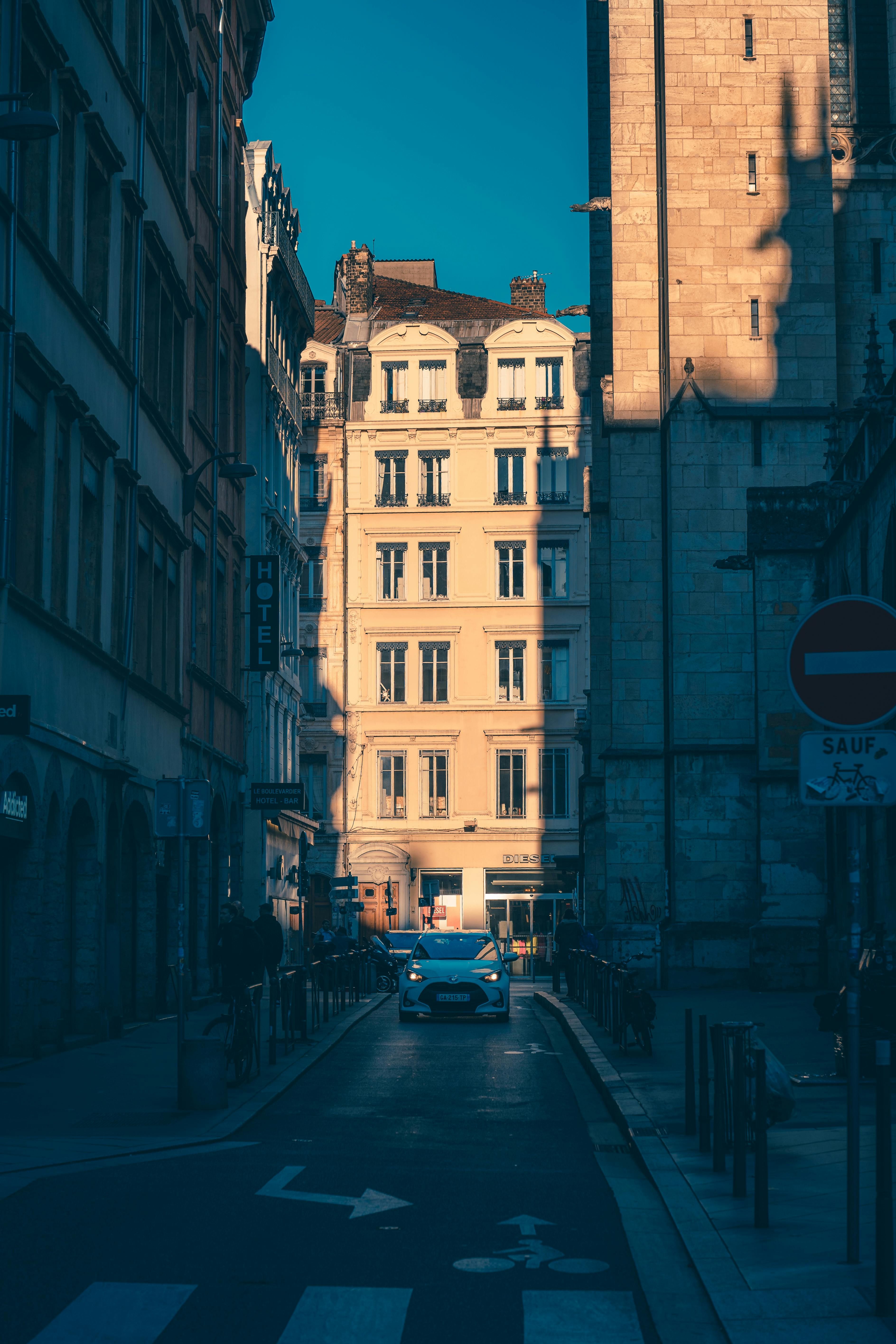 Narrow One Way City Street · Free Stock Photo