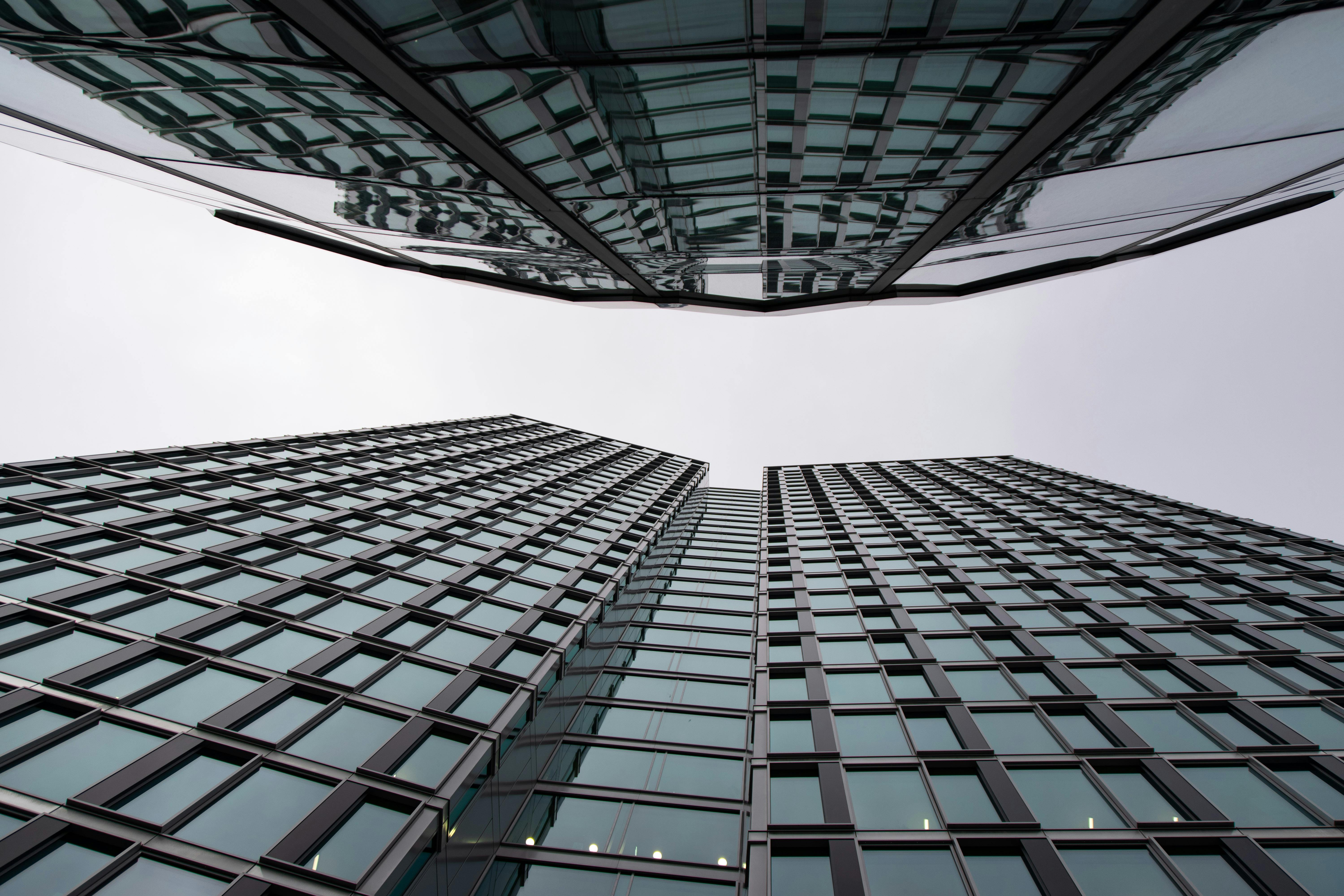 A view of tall buildings from below · Free Stock Photo