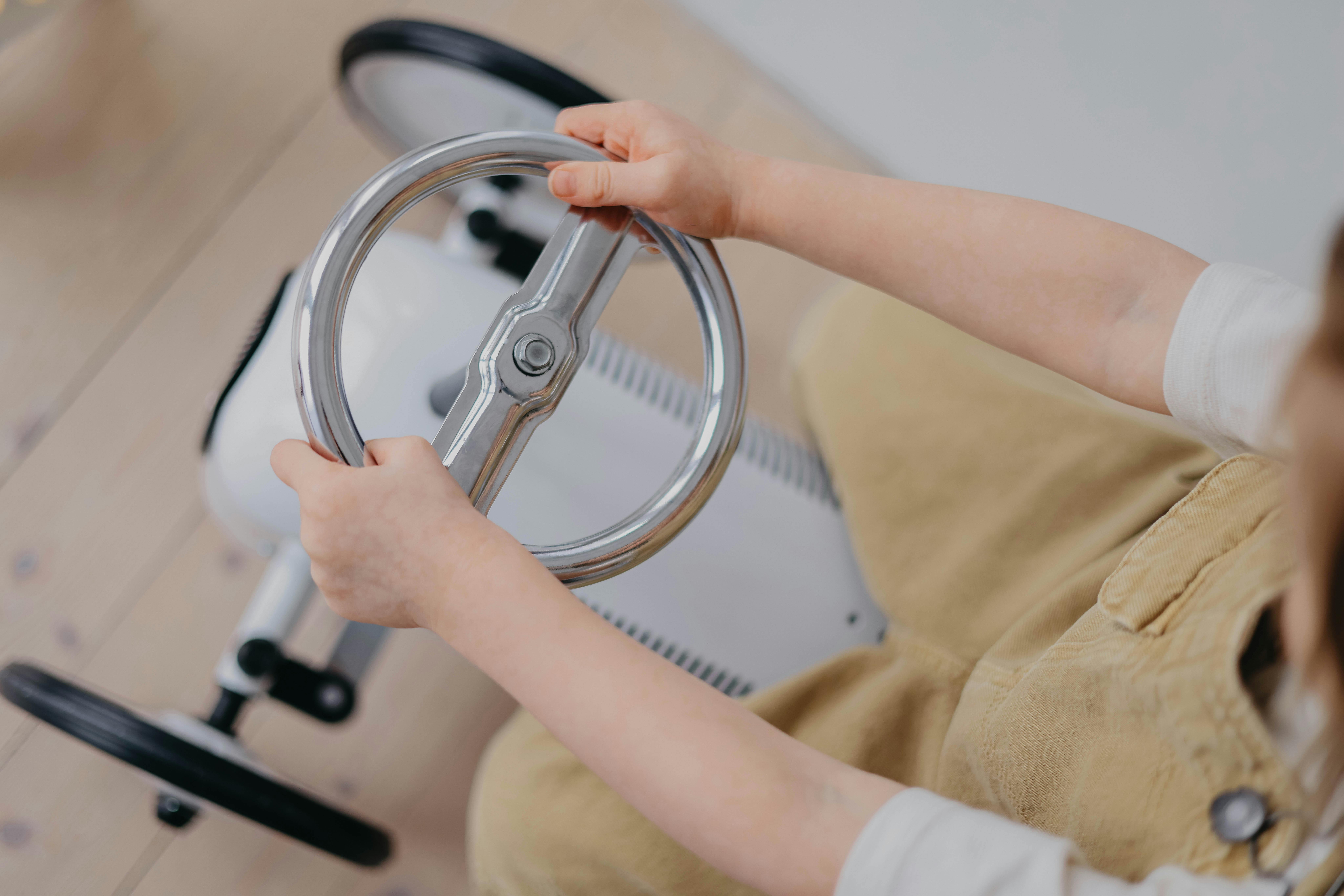 Child Riding on Car Toy · Free Stock Photo