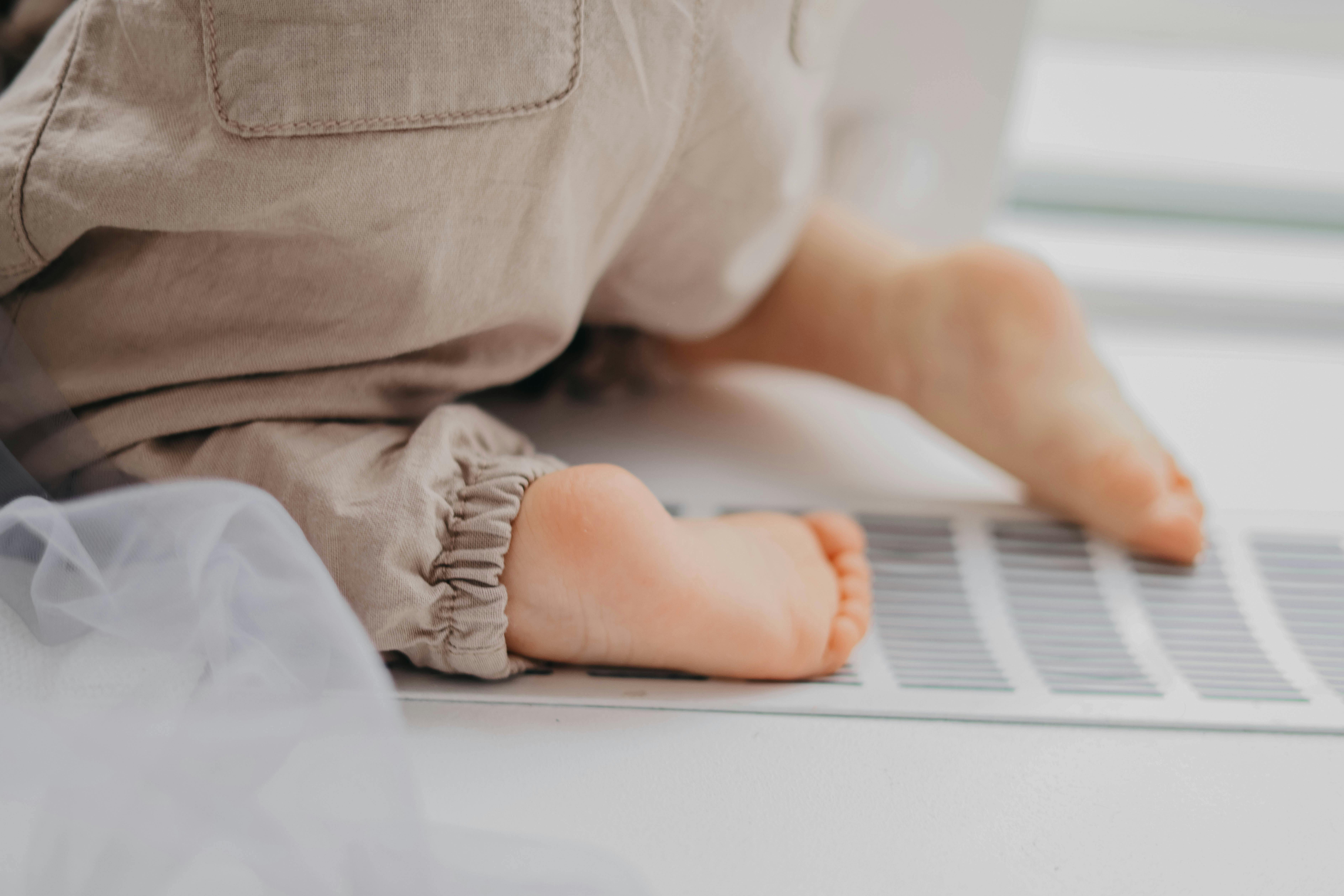 Barefoot Child Kneeling · Free Stock Photo