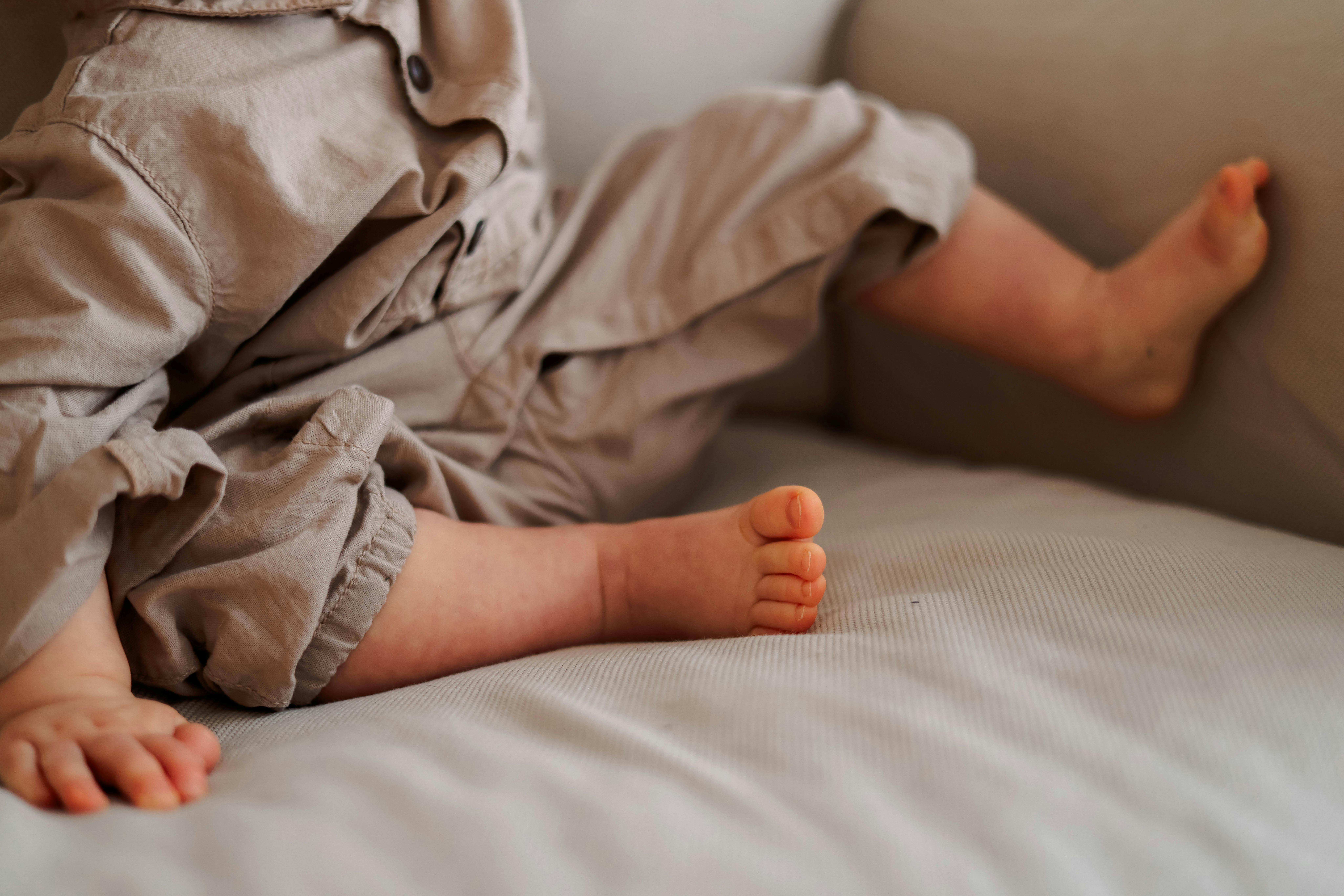 Legs of Sitting Baby · Free Stock Photo