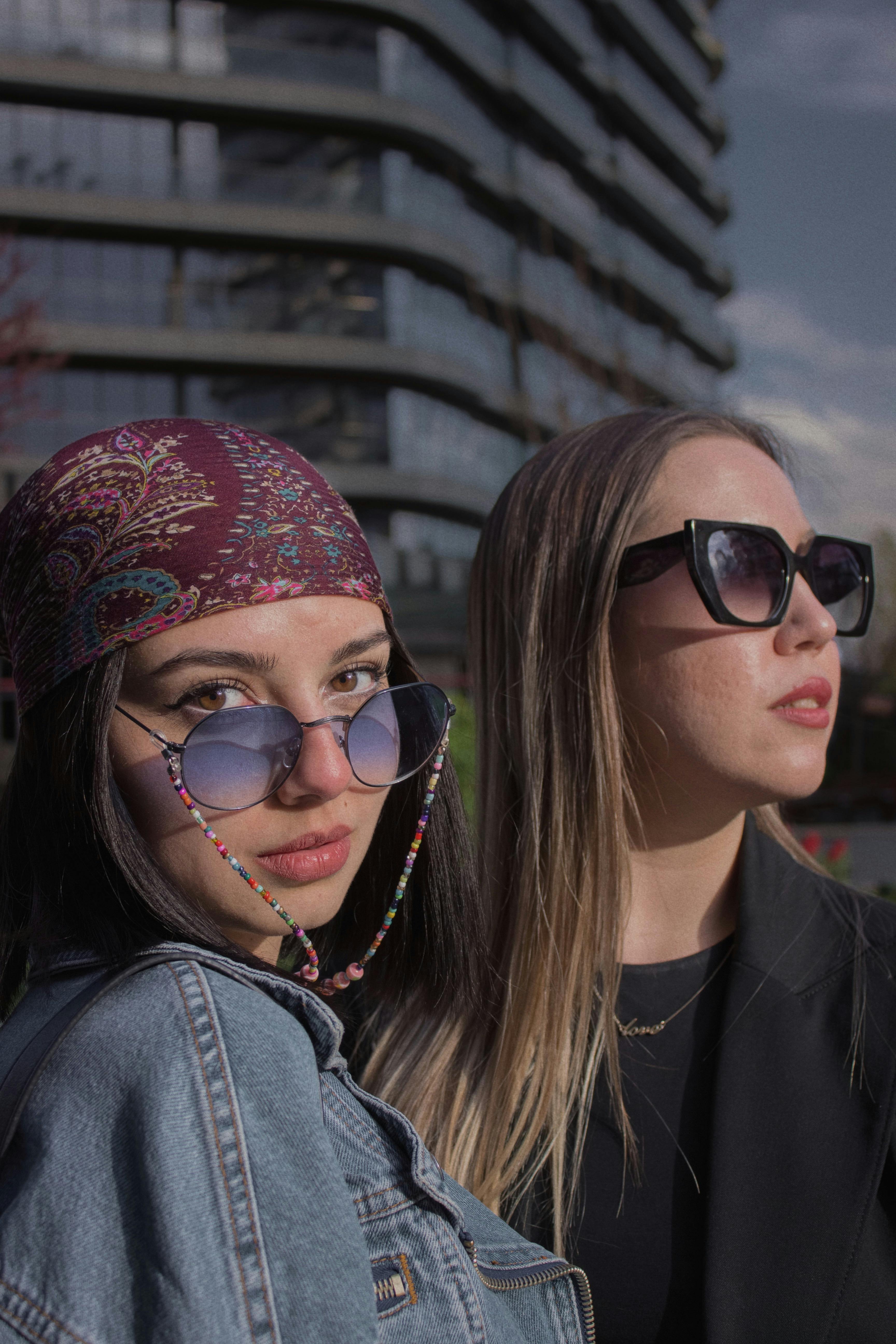 Two women wearing sunglasses and bandanas · Free Stock Photo