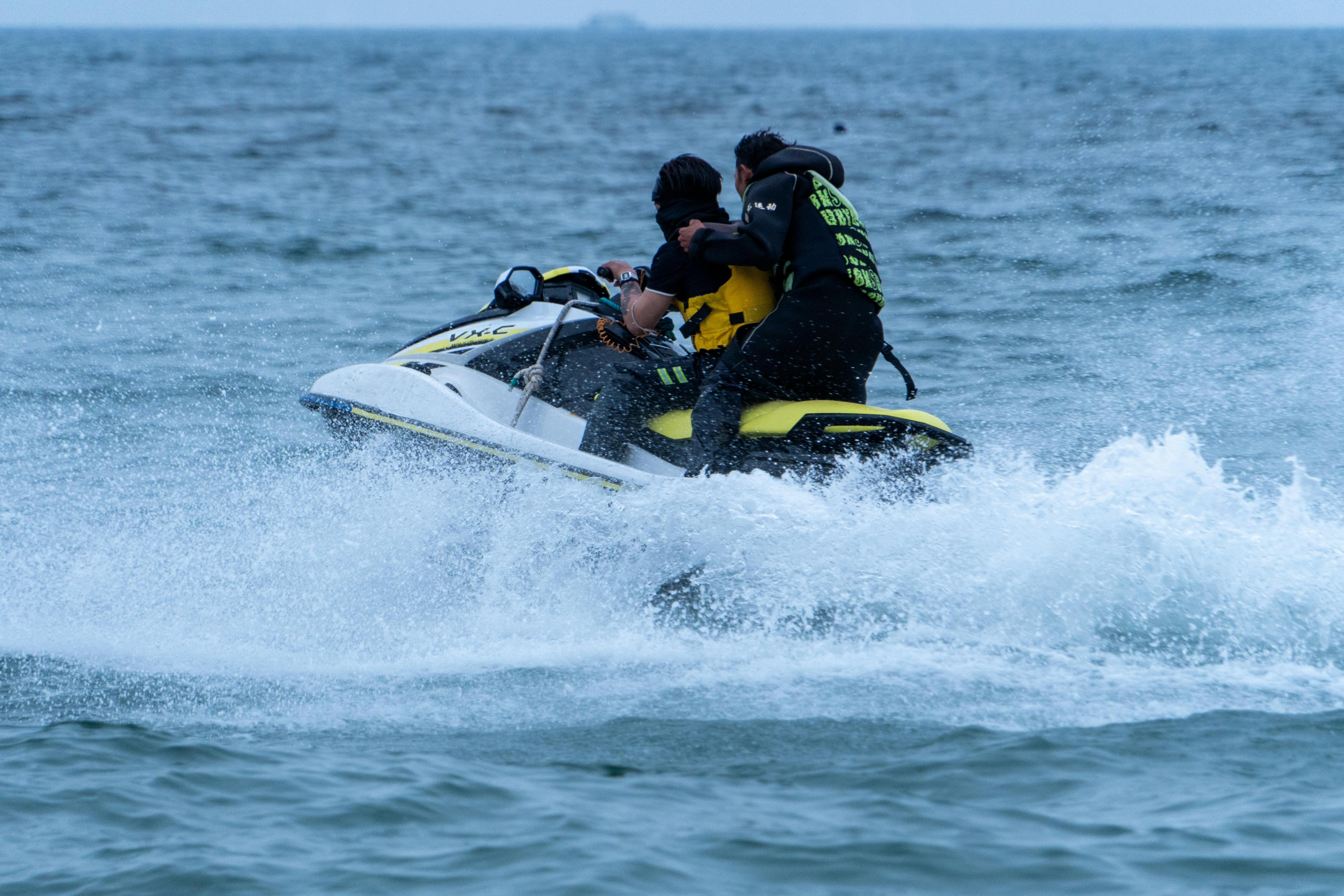 People Riding A Jet Ski · Free Stock Photo