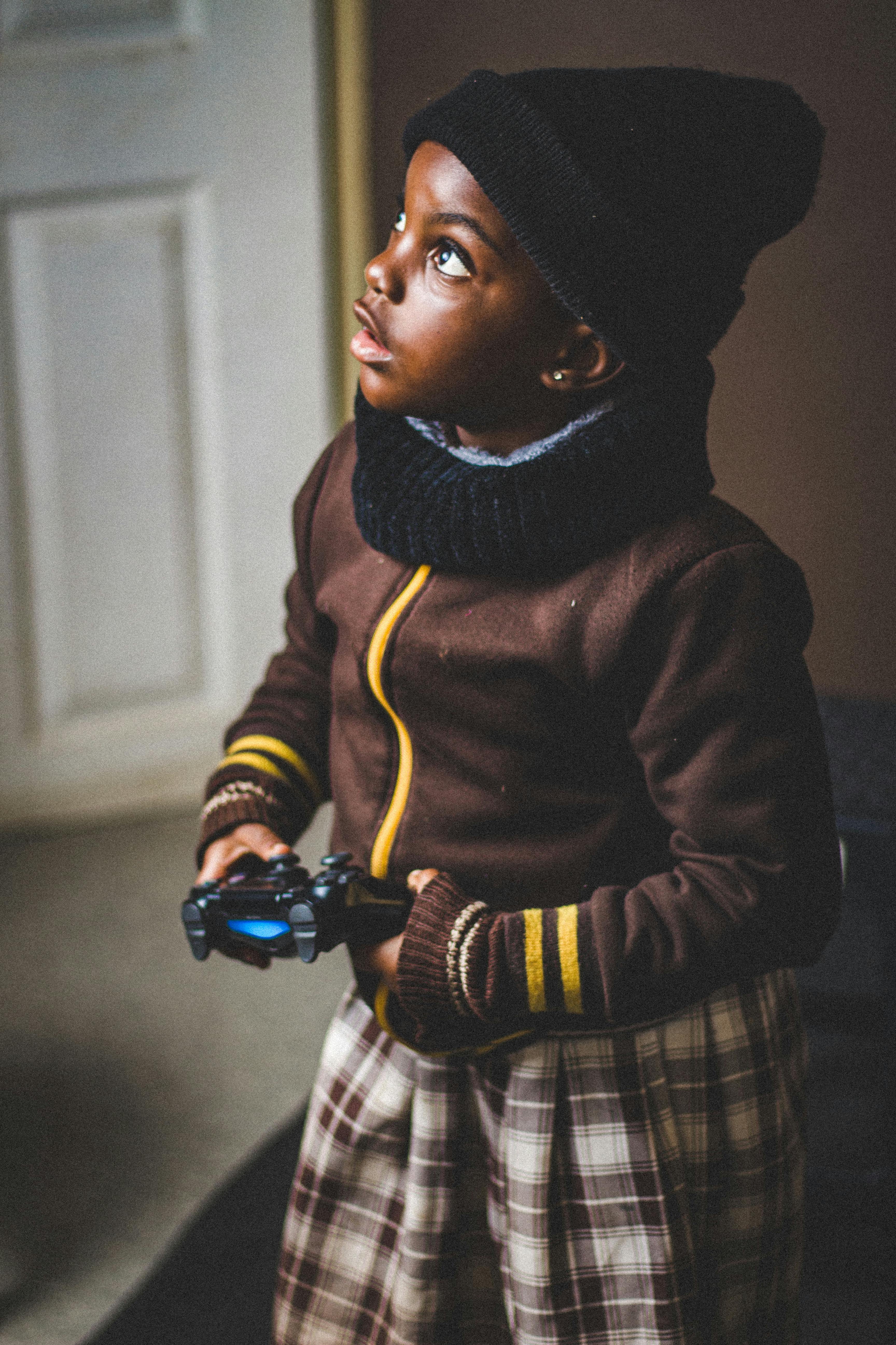 Child Holding Controller · Free Stock Photo