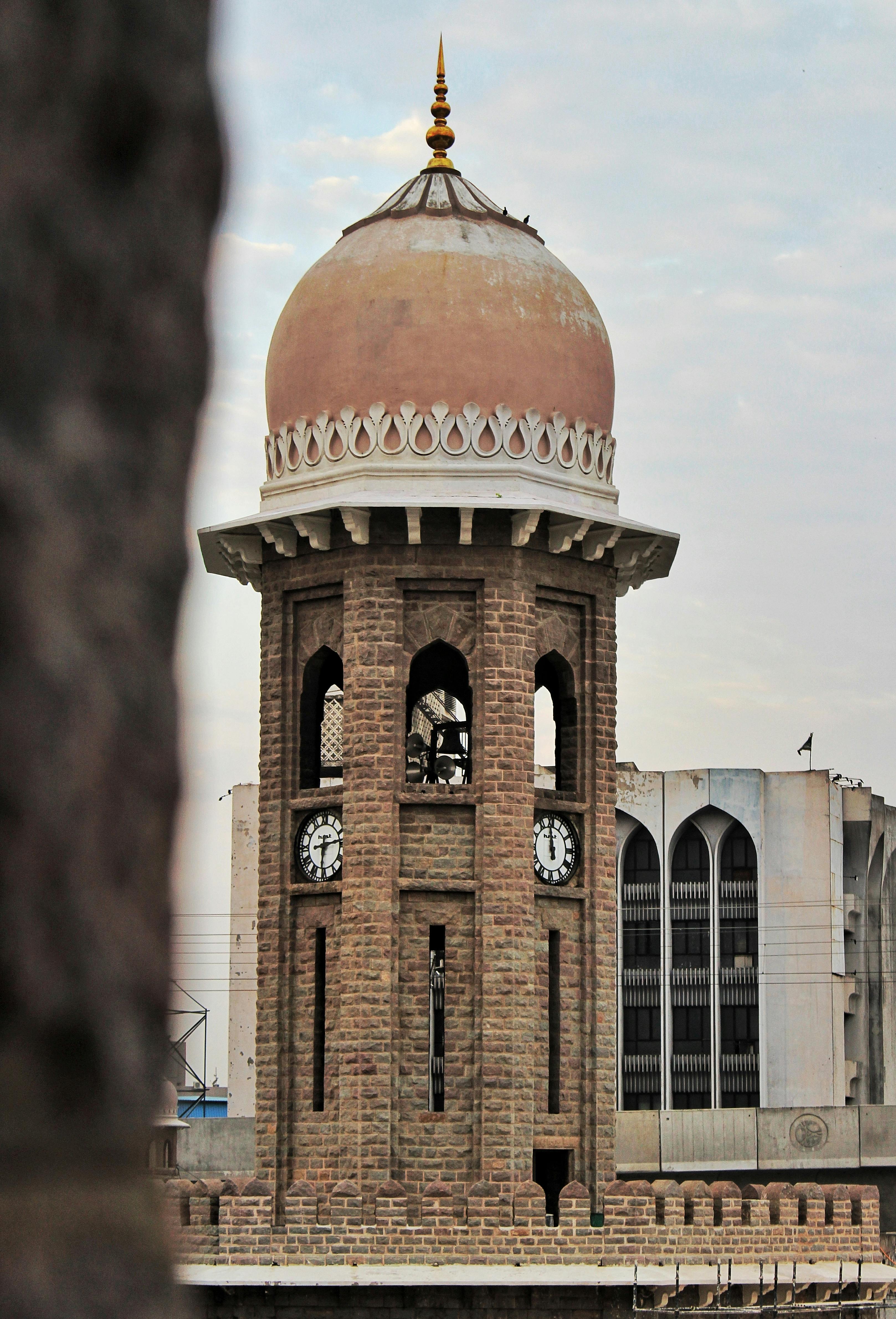 A Clock Tower with a Dome on Top · Free Stock Photo