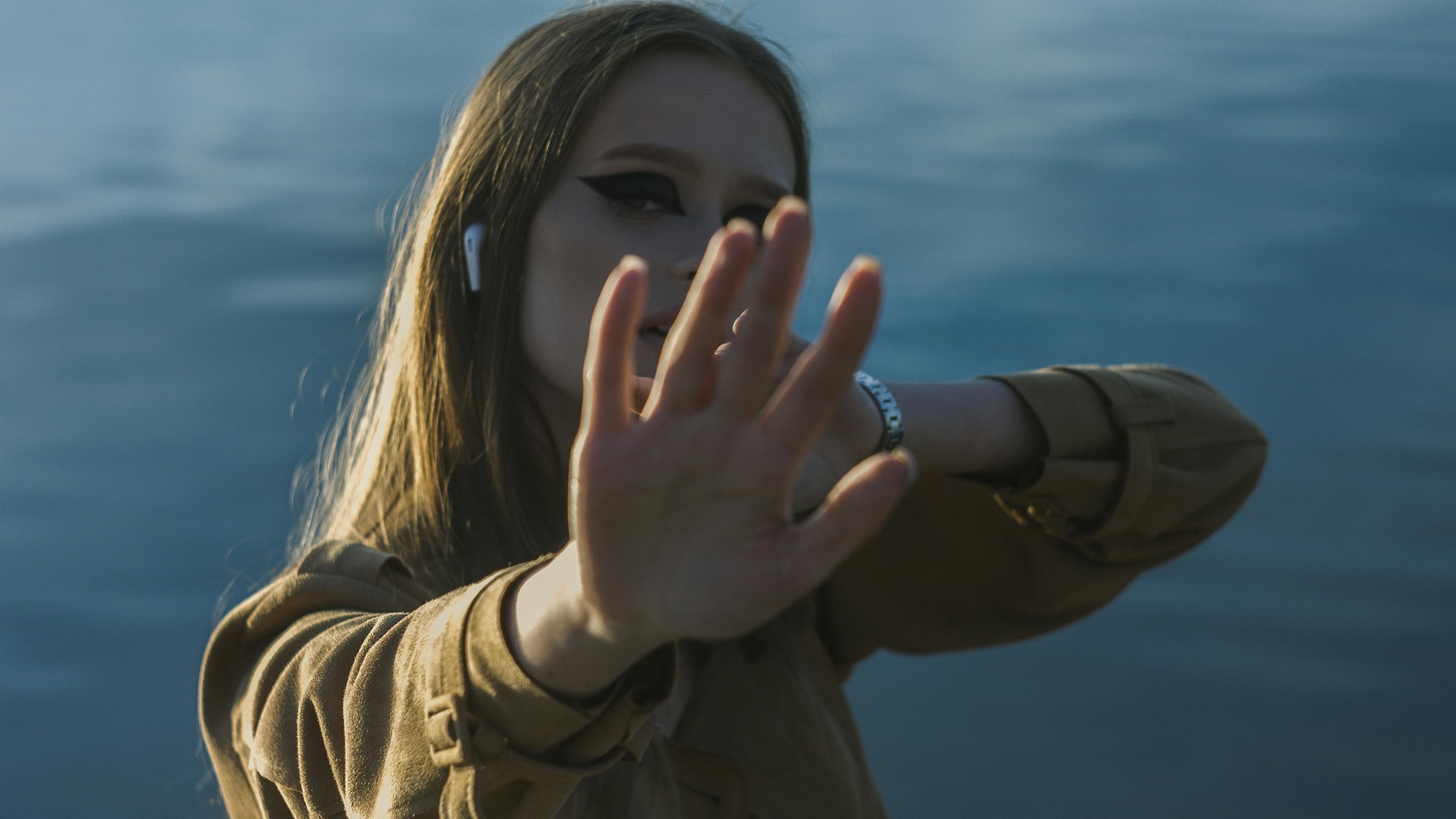 Young Woman Showing Hand to Camera · Free Stock Photo