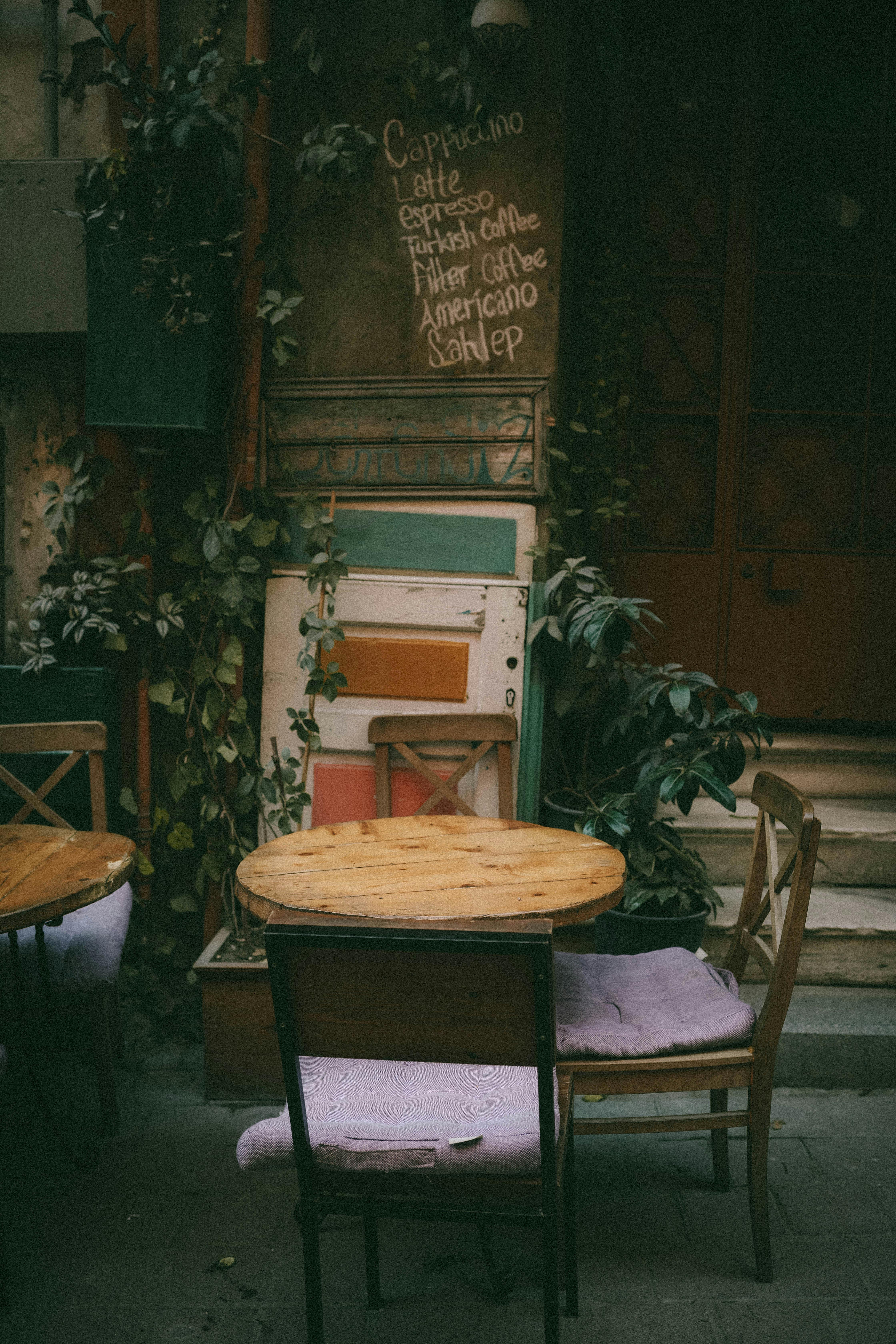 Empty Tables and Chairs Standing Outside of a Building · Free Stock Photo