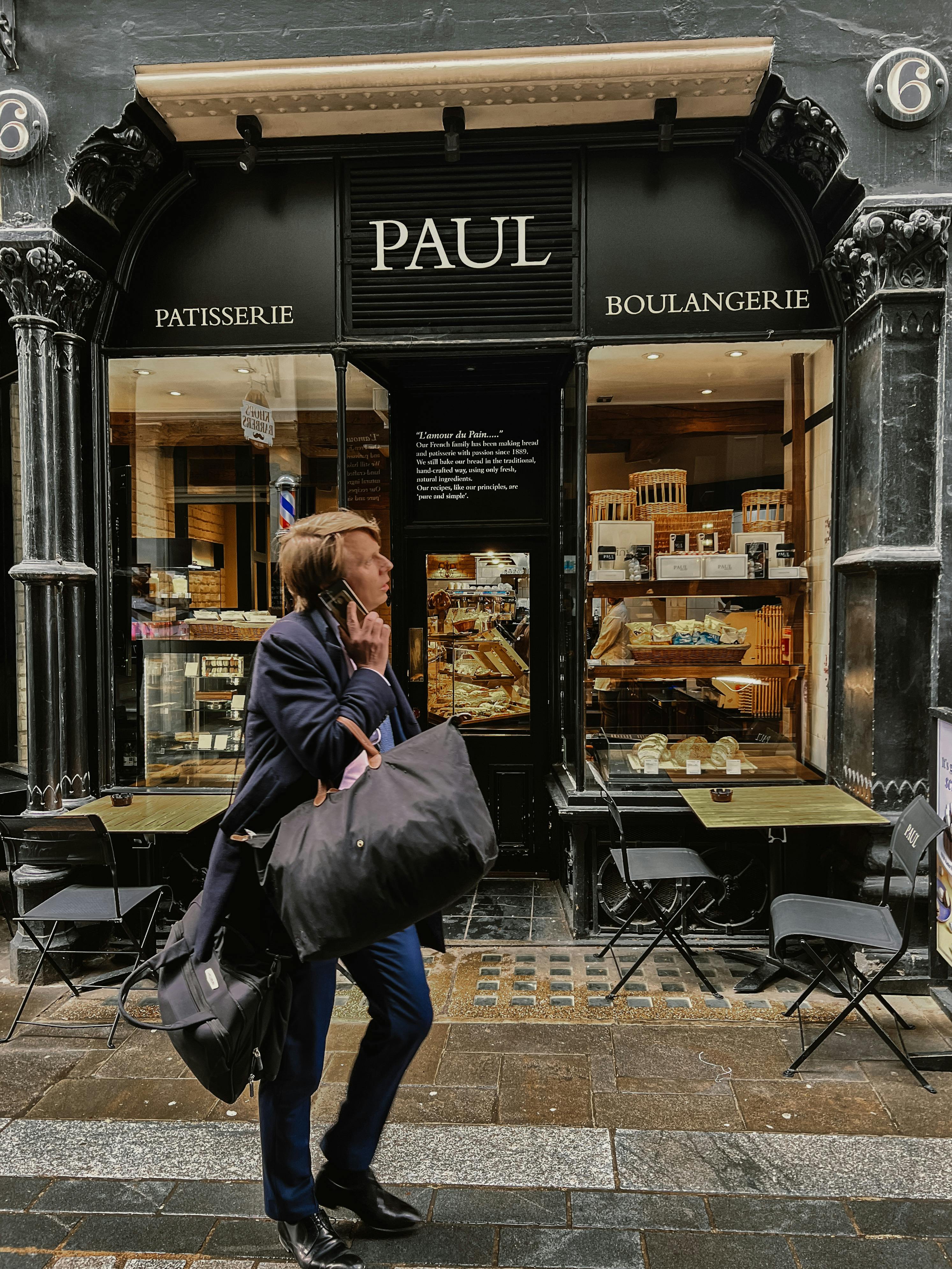 Man Walking near Bakery · Free Stock Photo