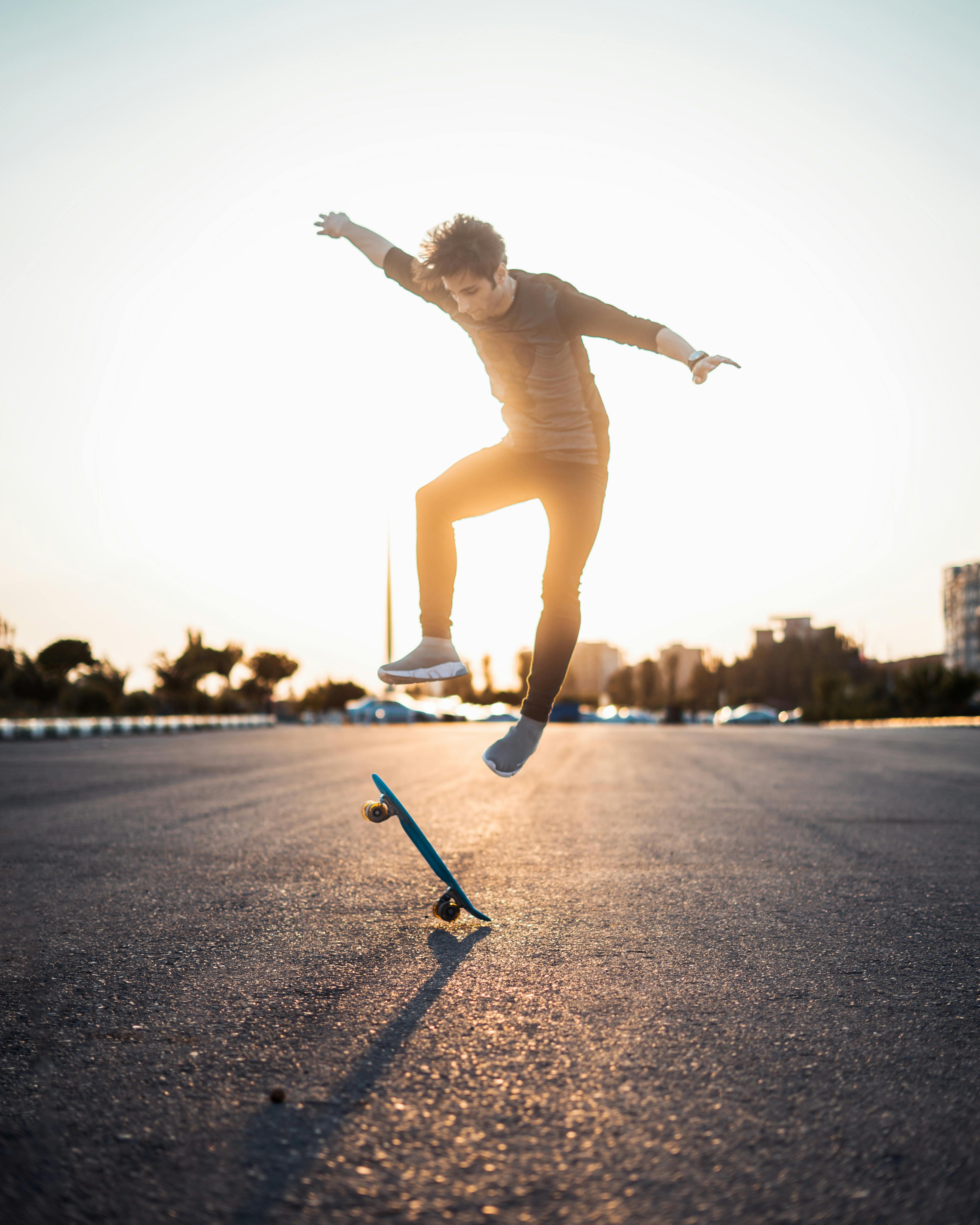 Man Jumping on Rocks Over a River · Free Stock Photo