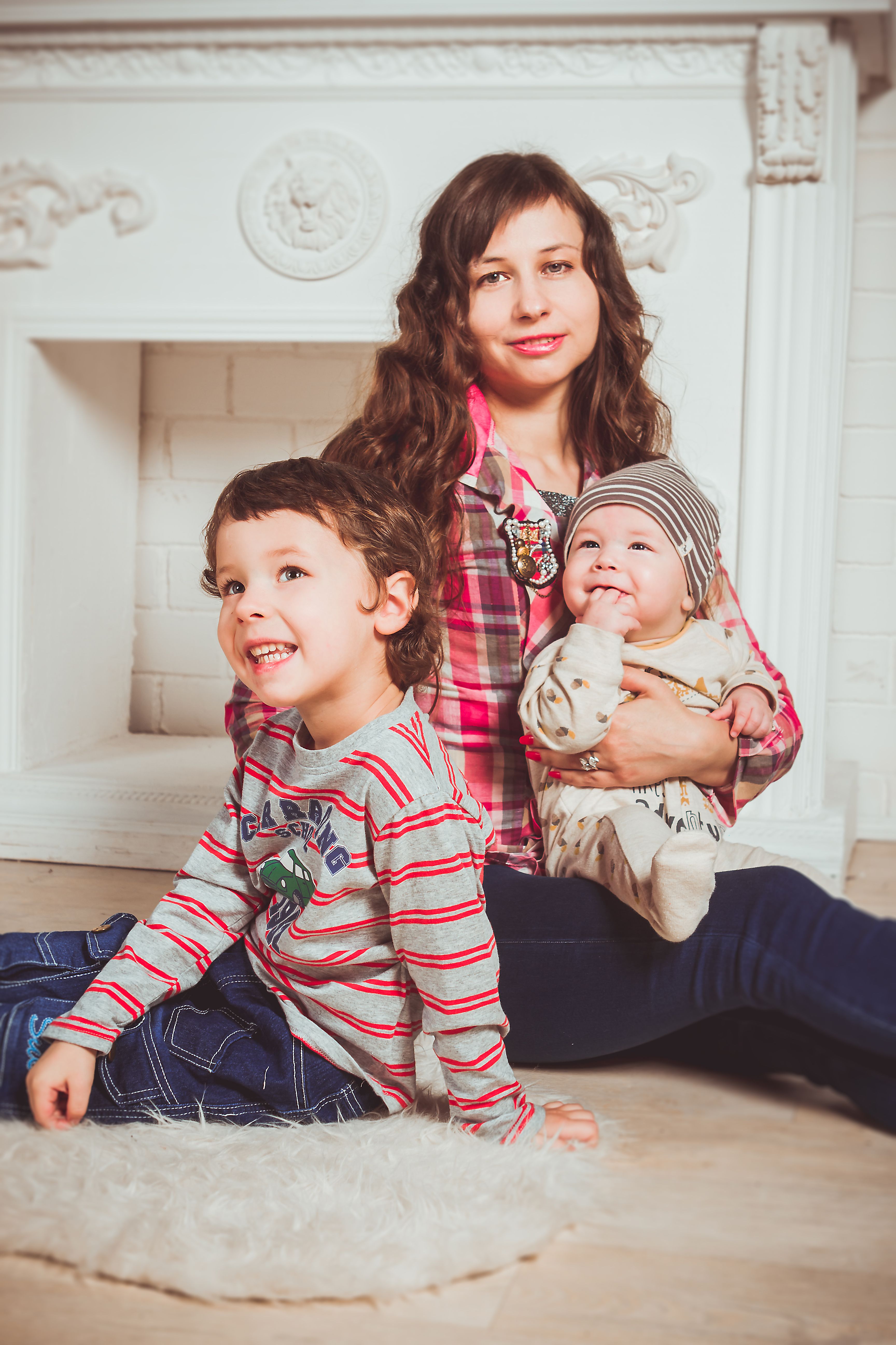 Woman Carrying Baby While Sitting Beside Little Boy · Free Stock Photo