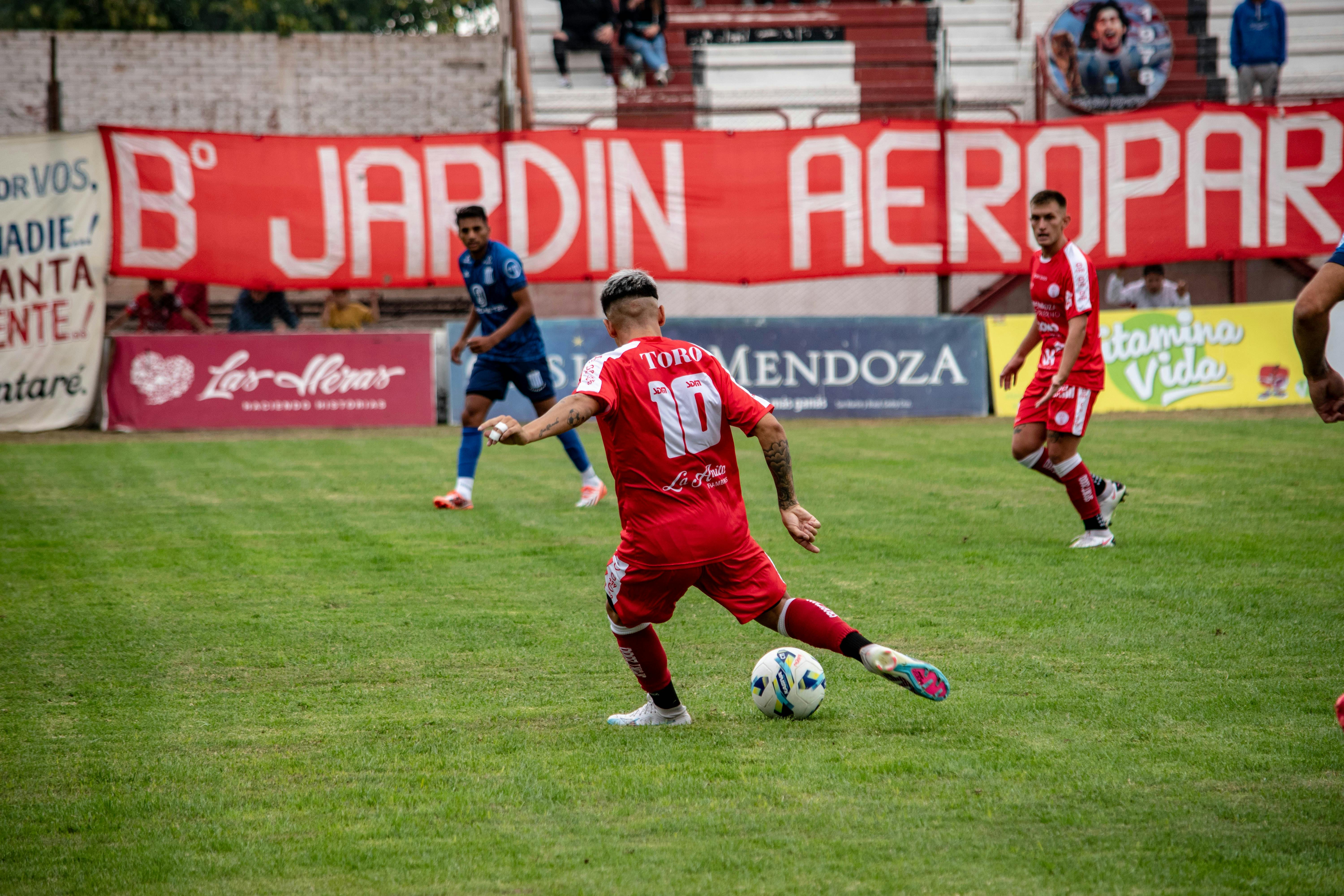 Soccer Players on the Field during a Match · Free Stock Photo
