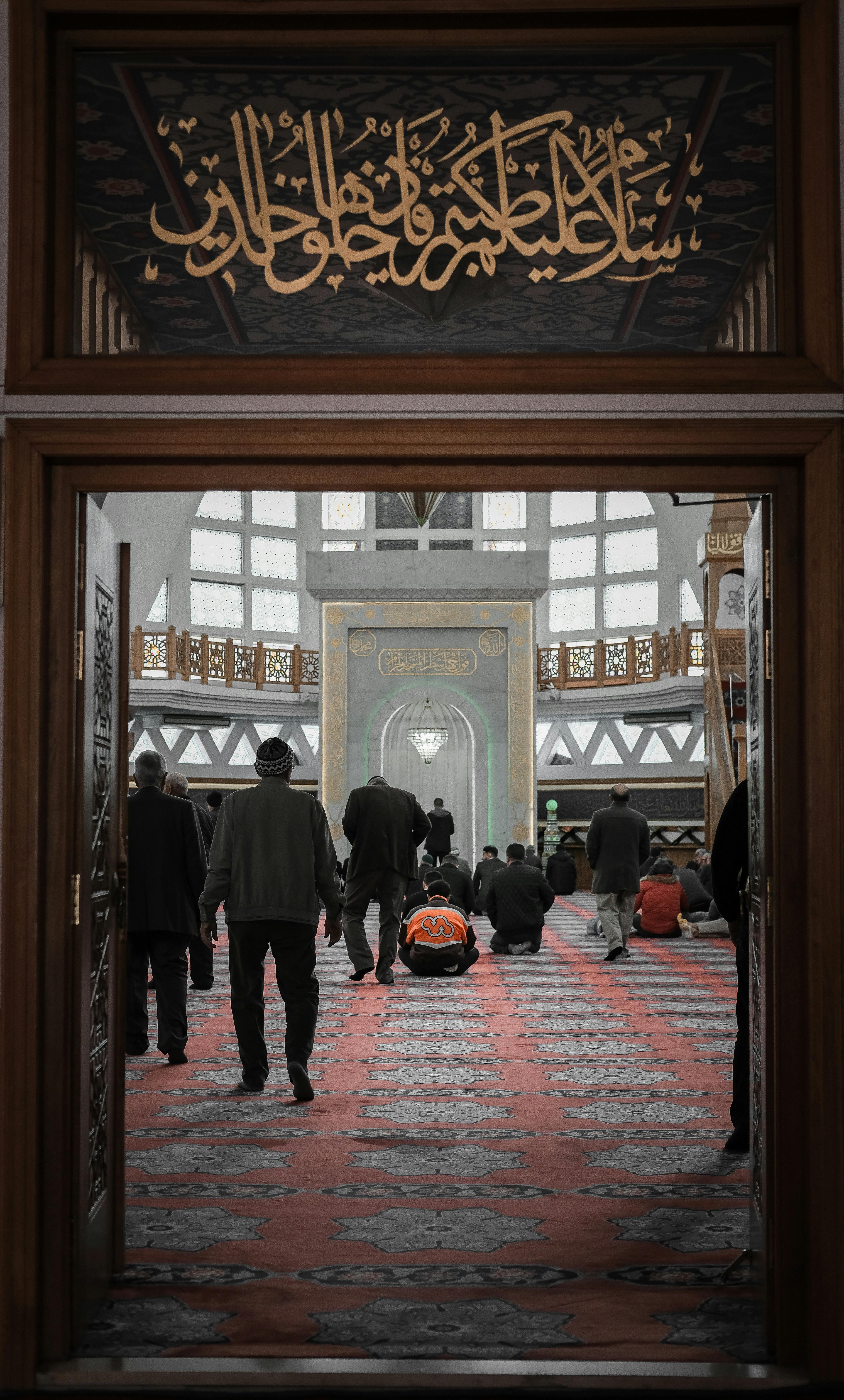 A Group of Men Sitting Inside a Mosque · Free Stock Photo